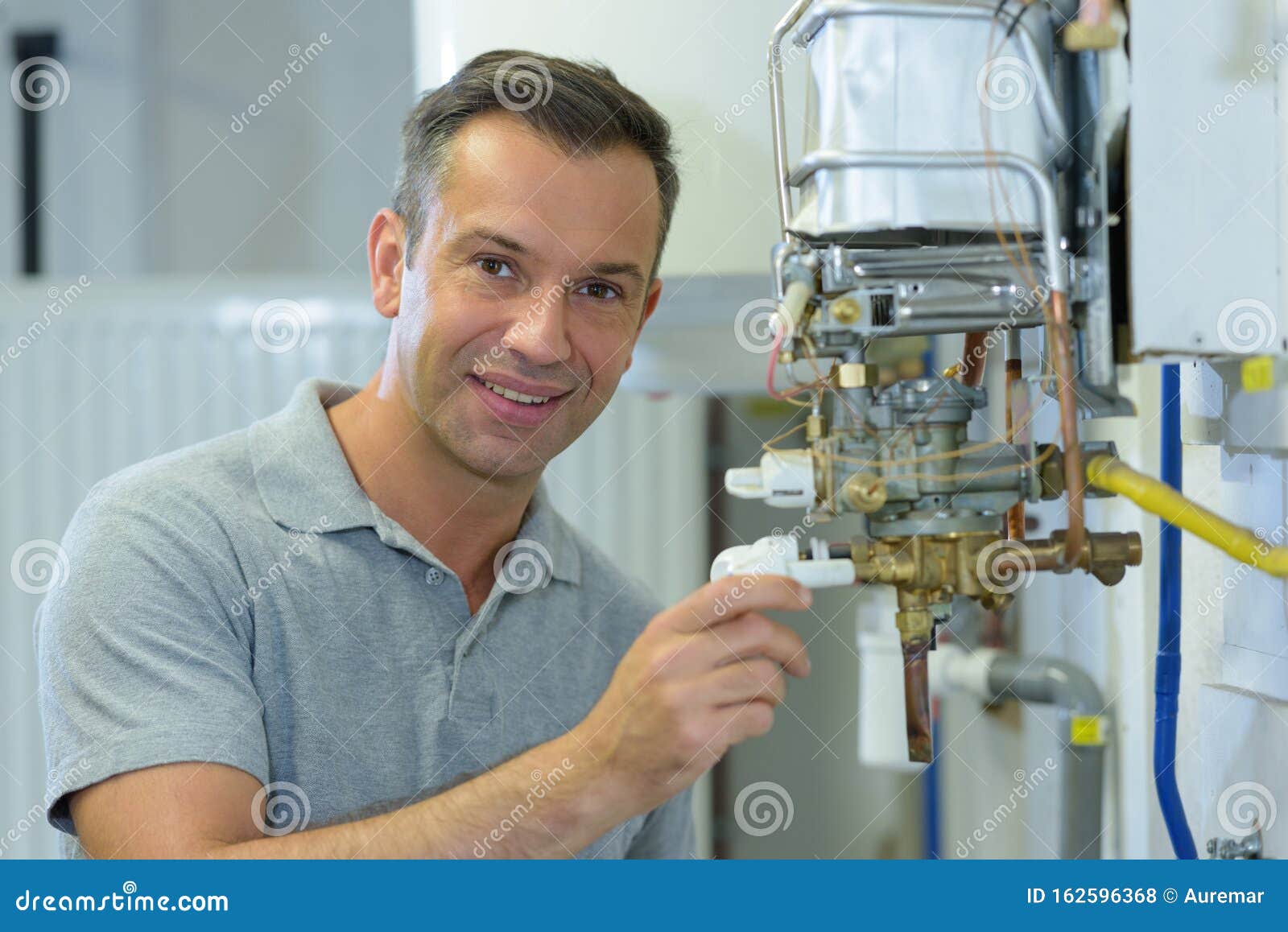 Portrait Man Adjusting Gas Boiler Stock Photo - Image of mature ...