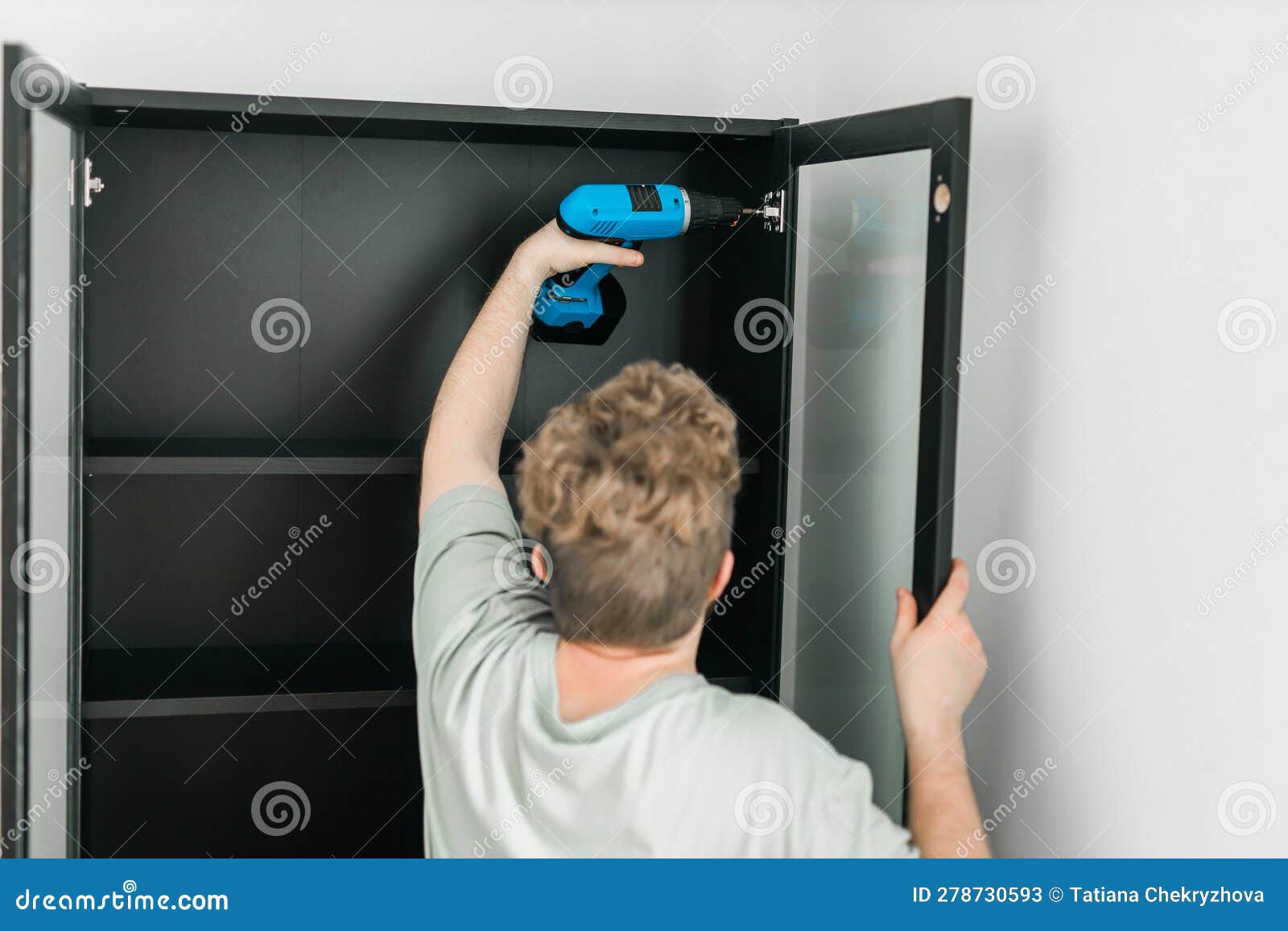 Portrait of Man Assembling Furniture. Do it Yourself Furniture Assembly ...
