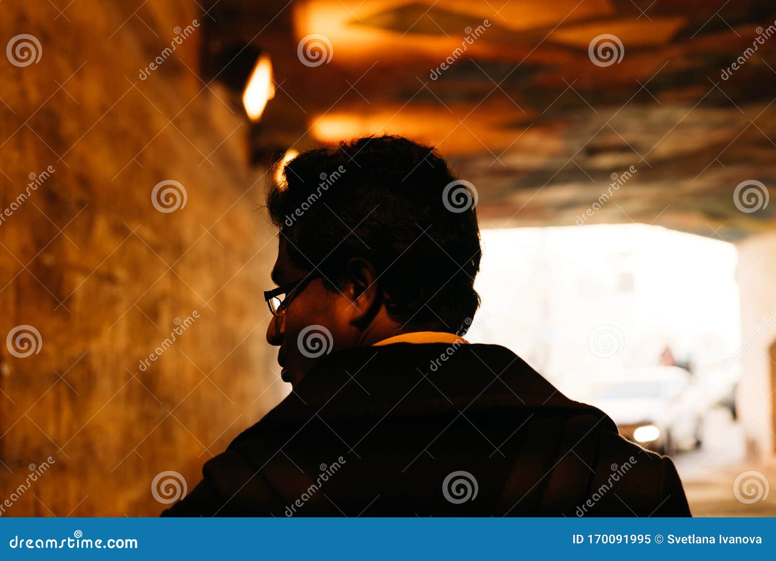 Portrait of a Man in the Backlight Looking Back in a Tunnel Stock Image ...