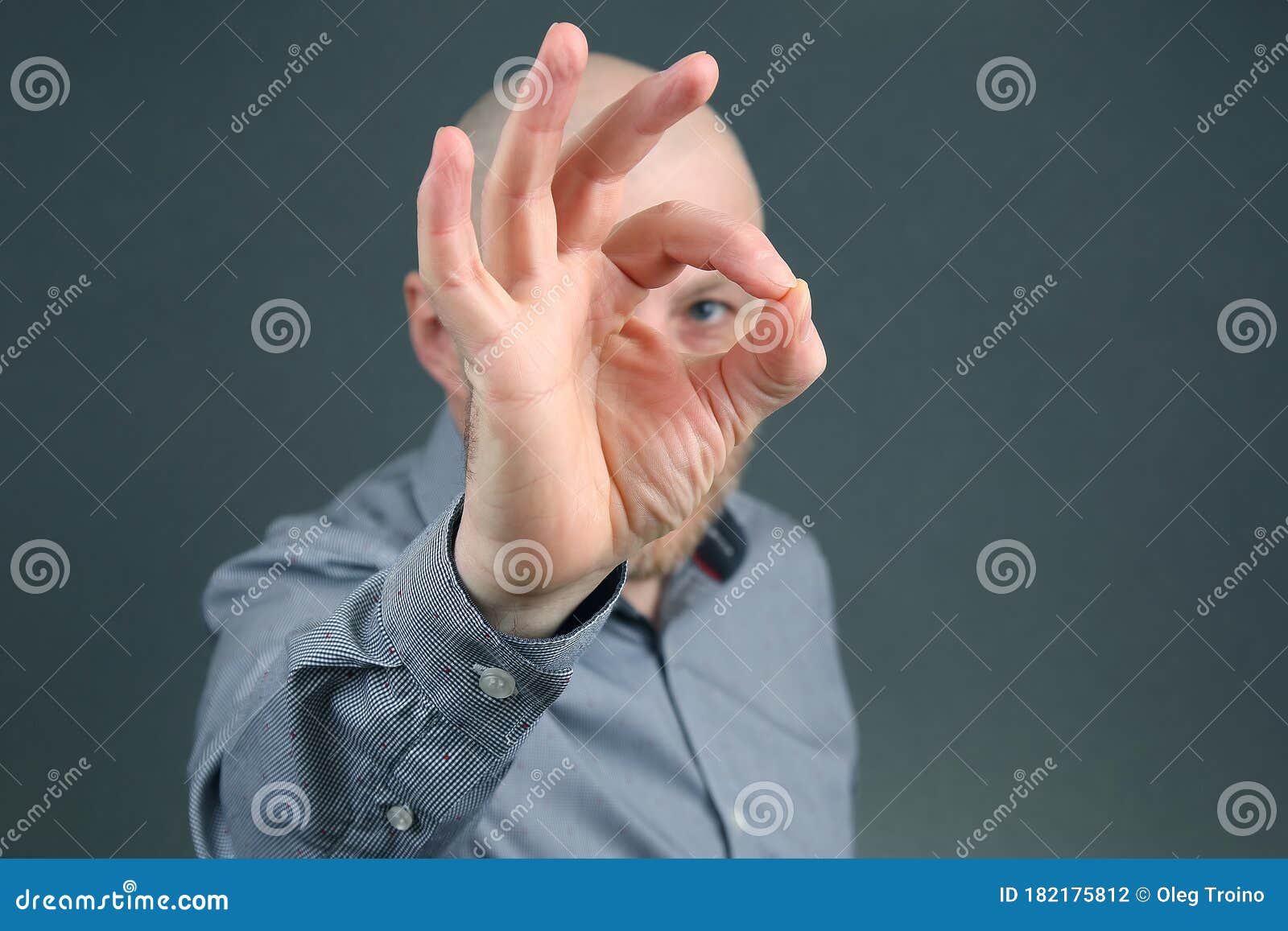 Portrait of a Man with a Beard Looking through His Fingers Stock Photo ...