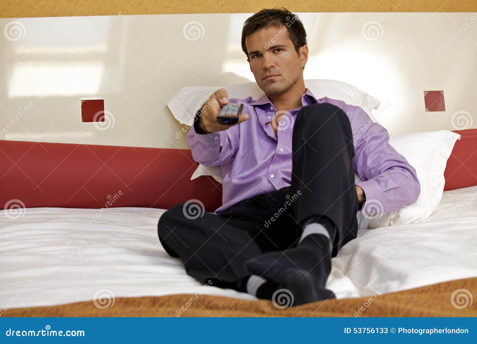 Portrait of Man on Bed Using Remote Control Stock Image - Image of ...