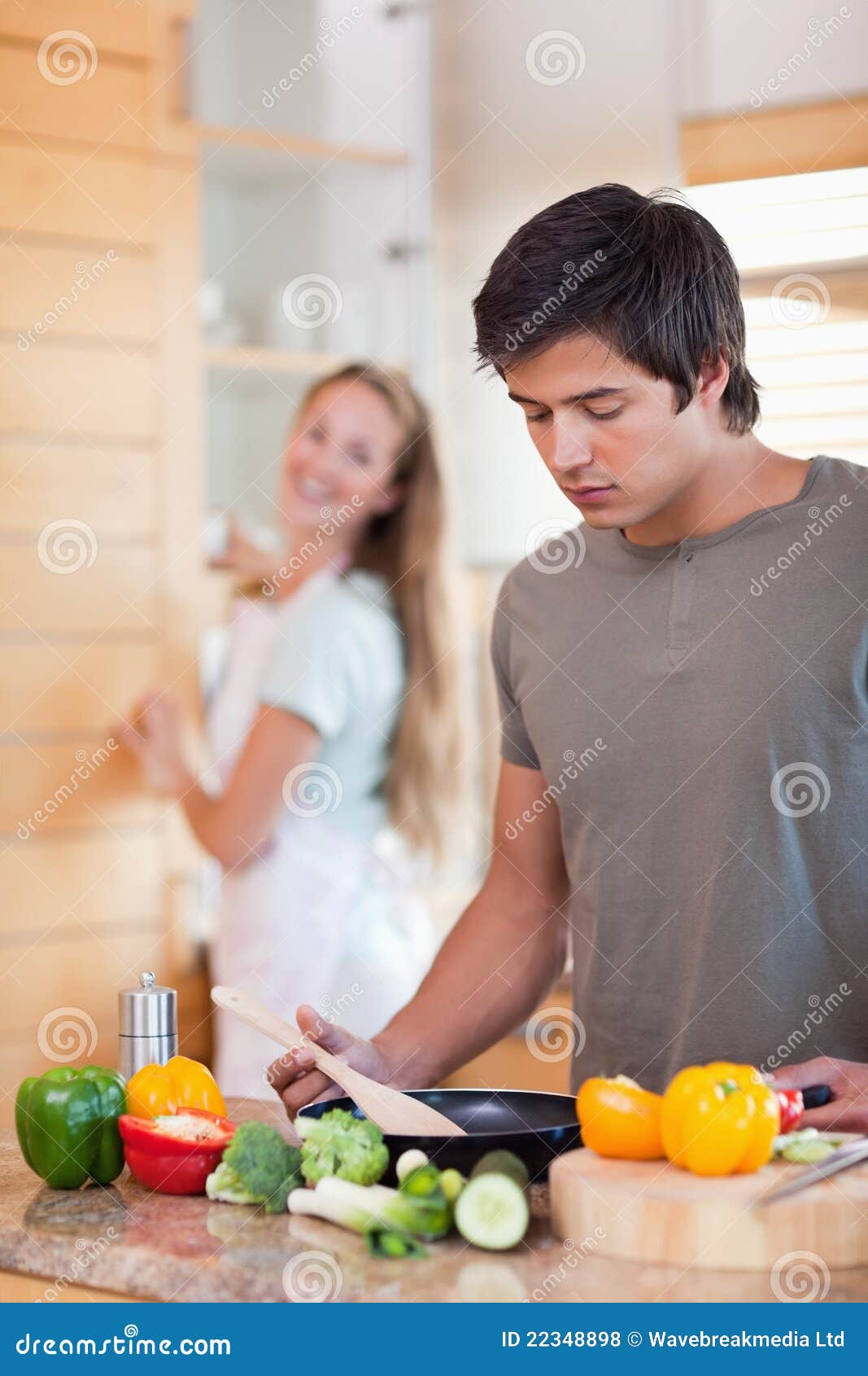 Portrait of a Man Cooking while His Wife is Washing the Dishes Stock ... Portrait of a Man Cooking while His Wife is Washing the Dishes Stock ...