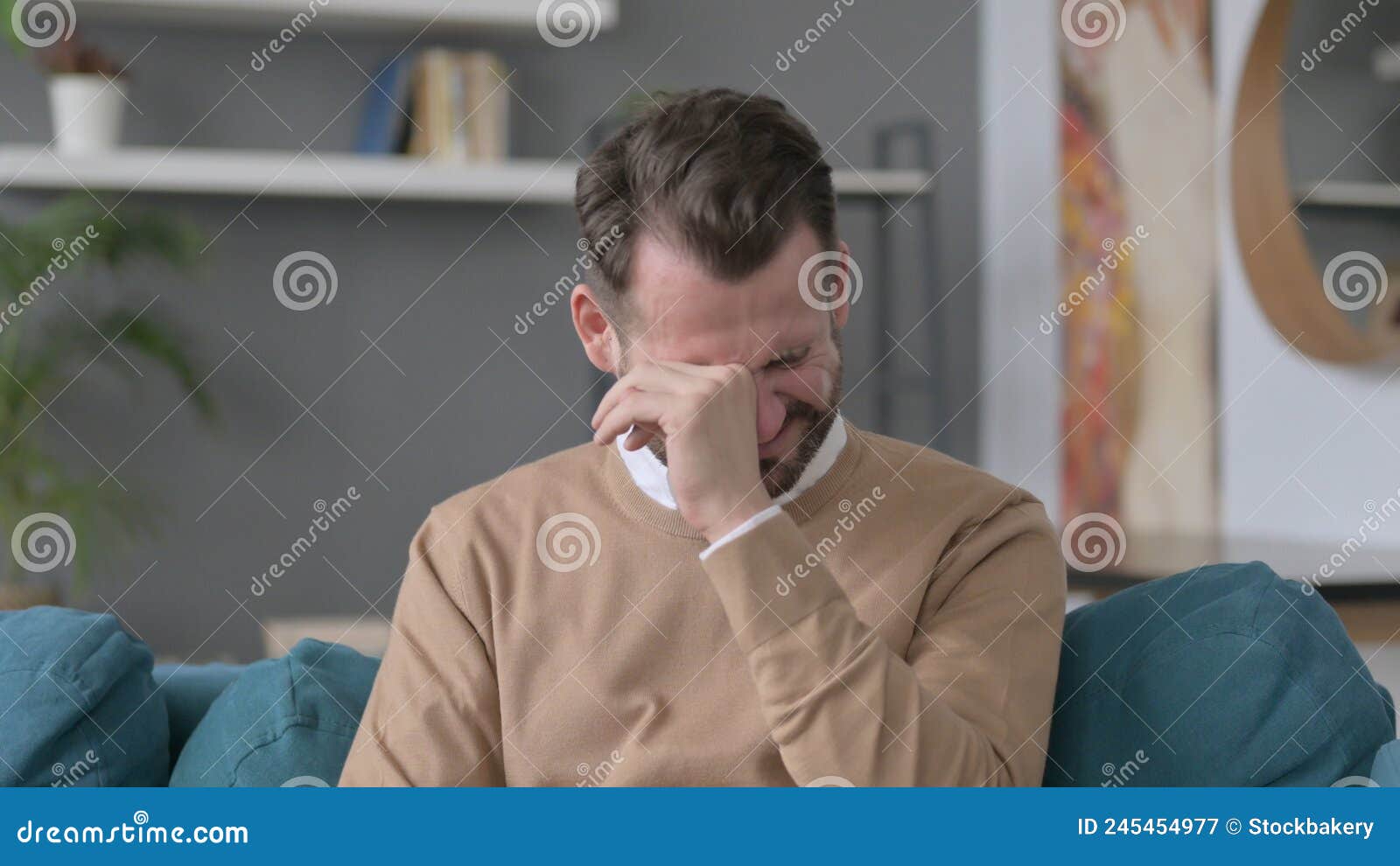 Portrait of Man Crying while Sitting on Sofa Stock Image - Image of ...