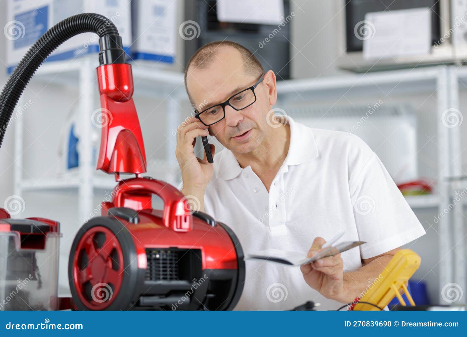 Portrait man fixing hoover stock photo. Image of adult - 270839690