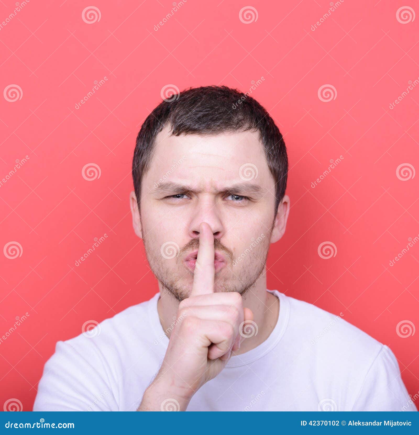 Portrait of Man with Gesture for Silence Against Red Background Stock ...