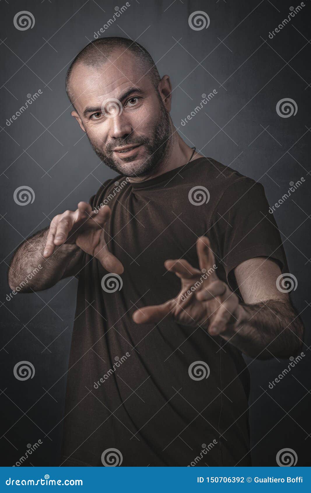 Portrait of Man with Hands Outstretched Forward in Magic Gesture Stock ...