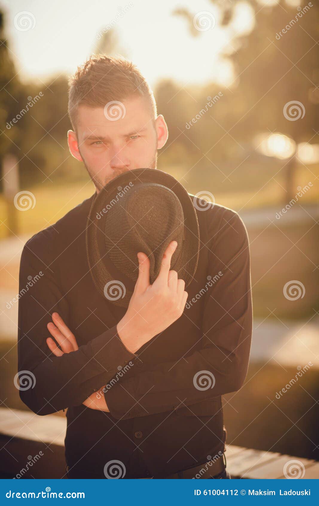 Portrait of a Man with Hat in Hand Stock Photo - Image of attractive ...