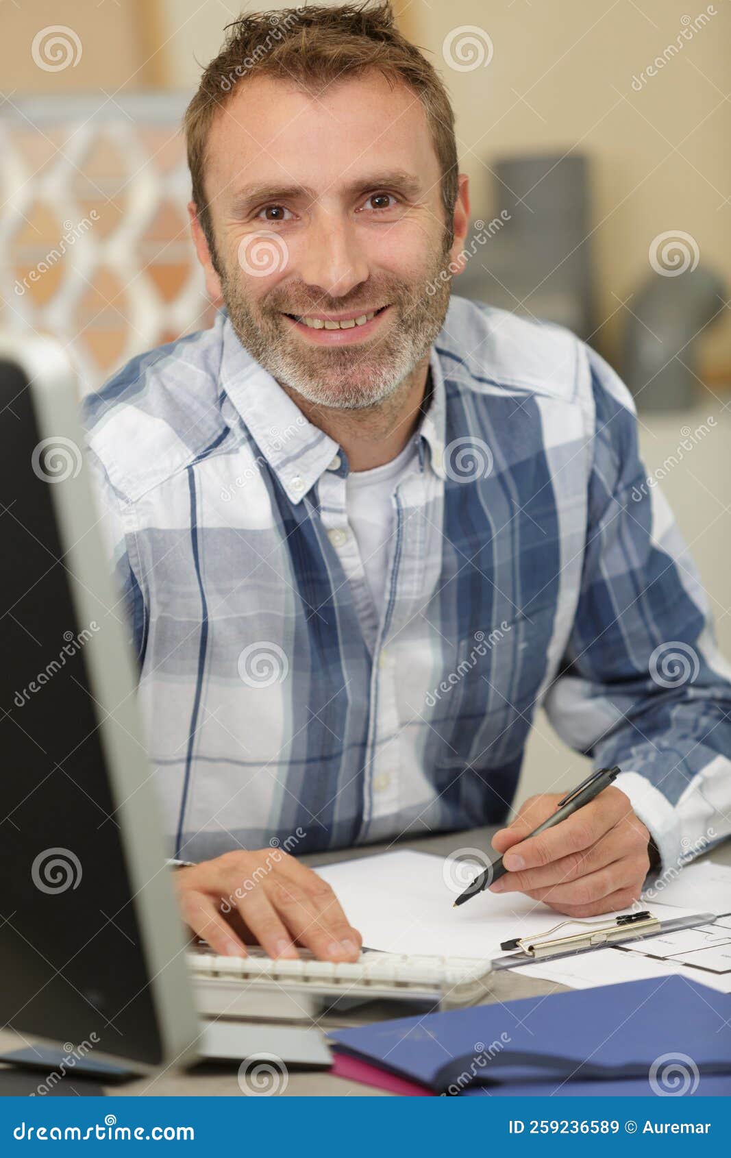 Portrait Man at Desk Typing and Writing Stock Image - Image of smile ...