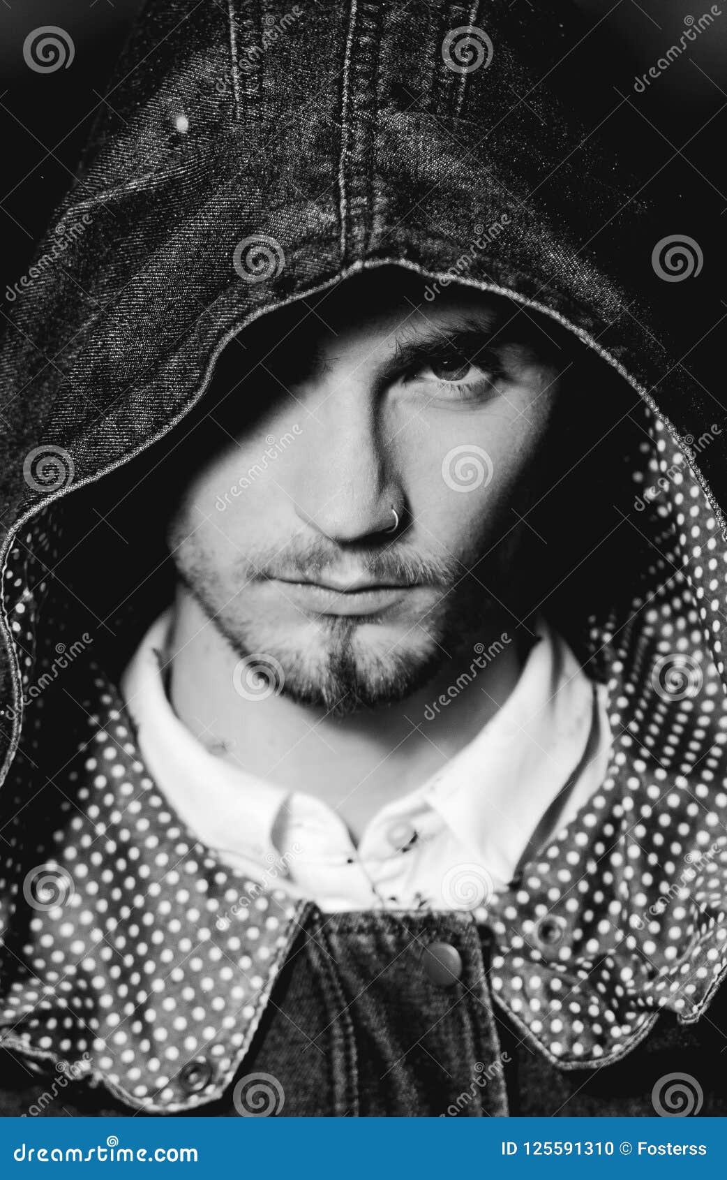 Portrait of man with hood stock photo. Image of camera - 125591310