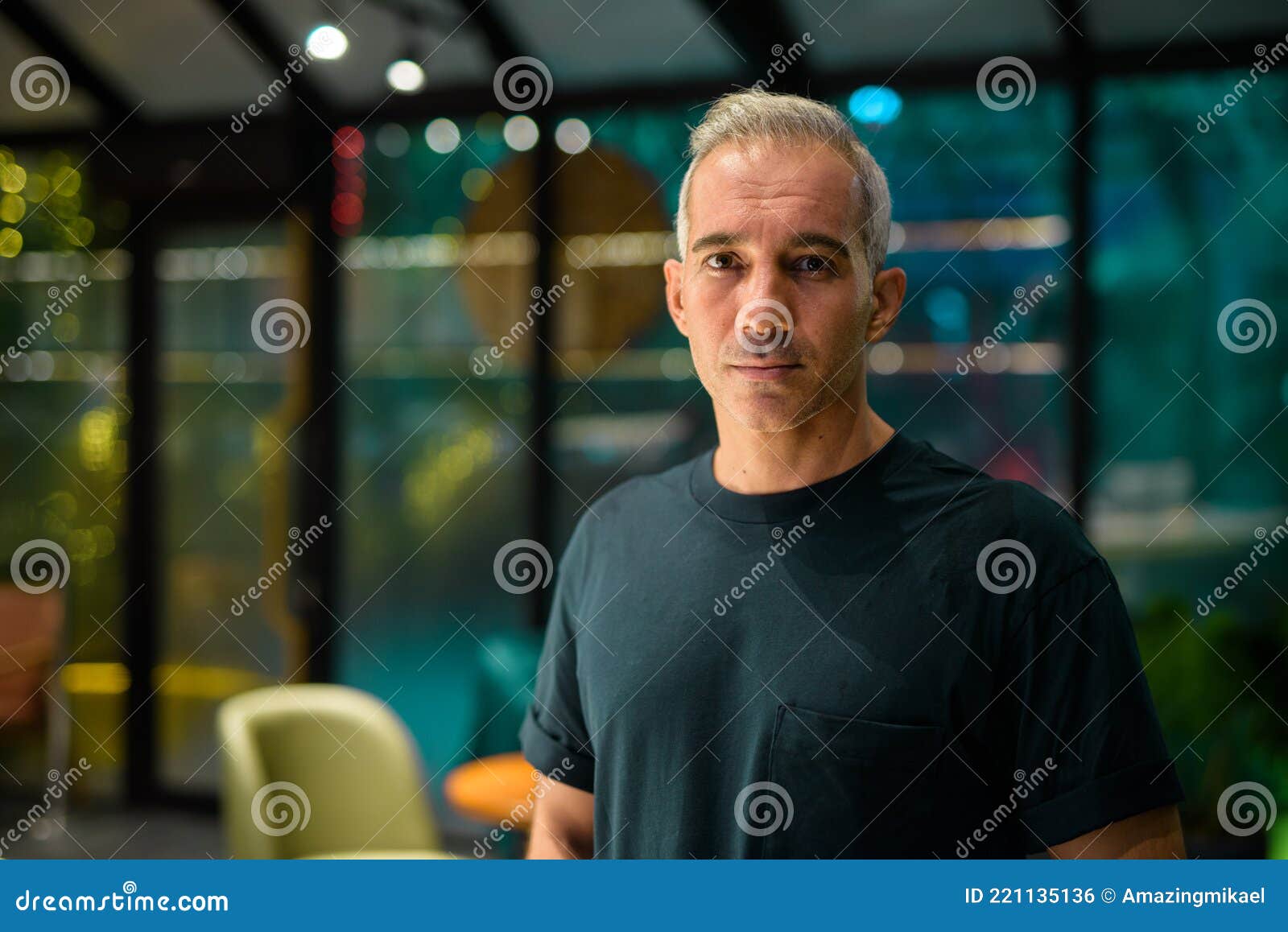 Portrait of Man Inside Coffee Shop at Night Looking at Camera Stock ...