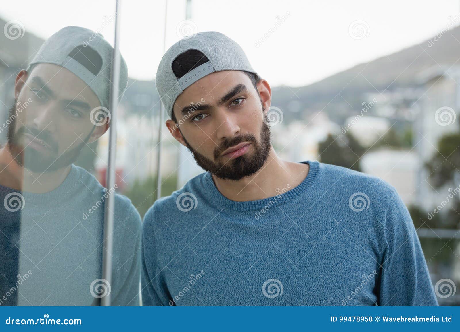 Man leaning on glass stock photo. Image of posing, confidence - 99478958