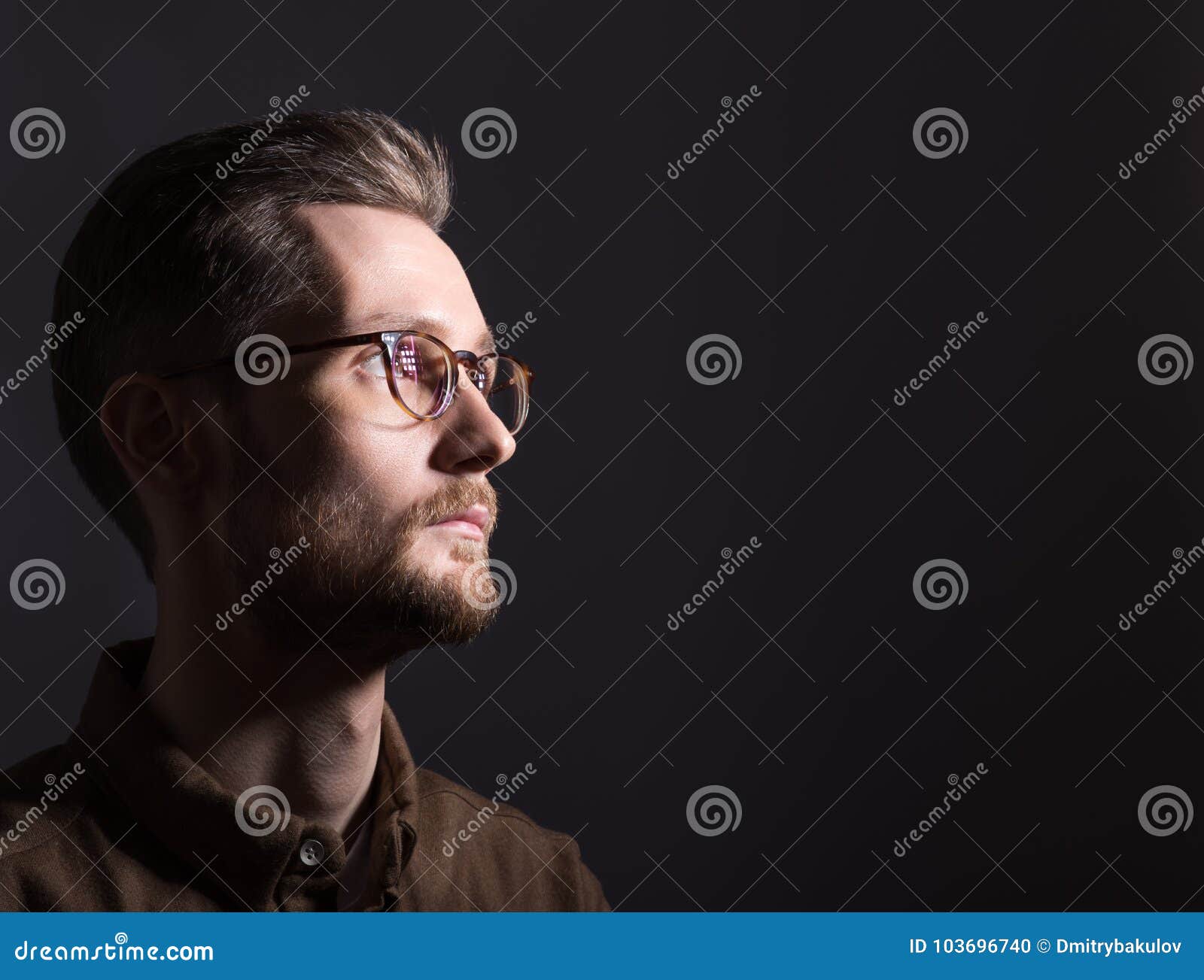 Portrait of a Man Looking at the Light from the Darkness Stock Photo ...