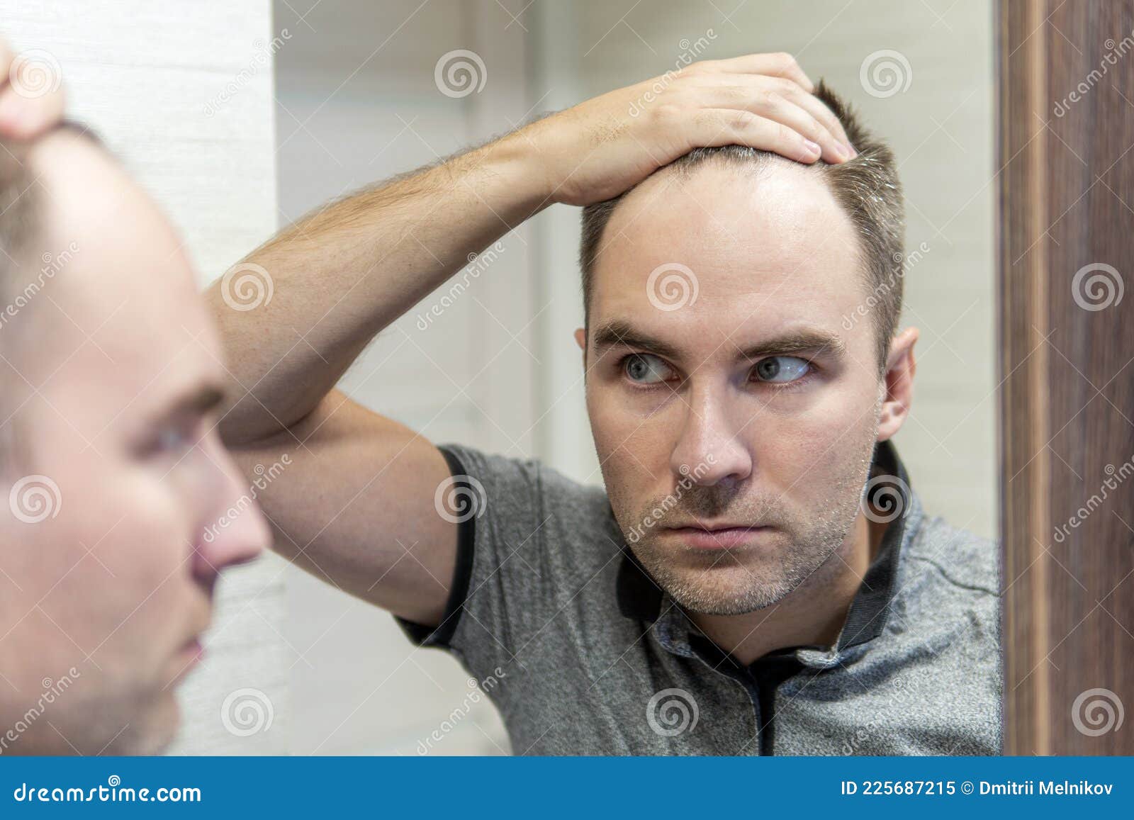 Portrait of a Man Looking in Mirror Stock Image - Image of aging, adult ...