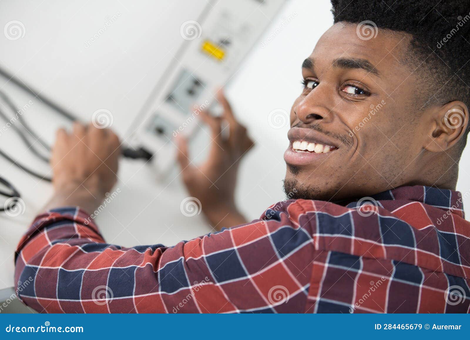 Portrait Man Plugging Power Cable into Electrical Device Stock Image ...