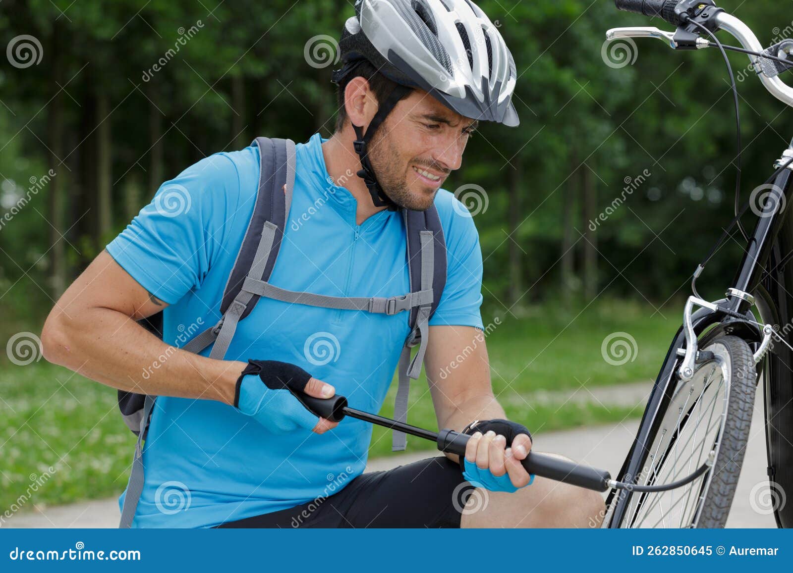 Portrait Man Pumping Bicycle Wheel Stock Image - Image of black ...