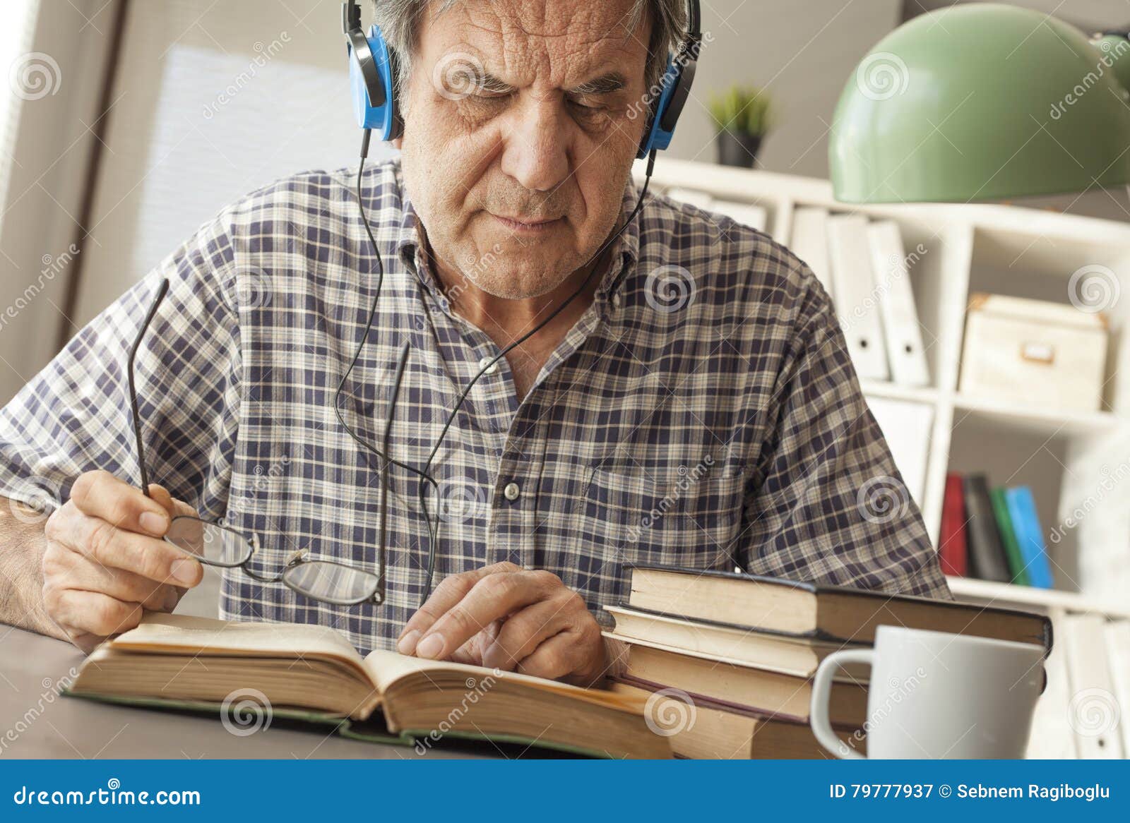Portrait of Man Reading Book Stock Image - Image of music, house: 79777937