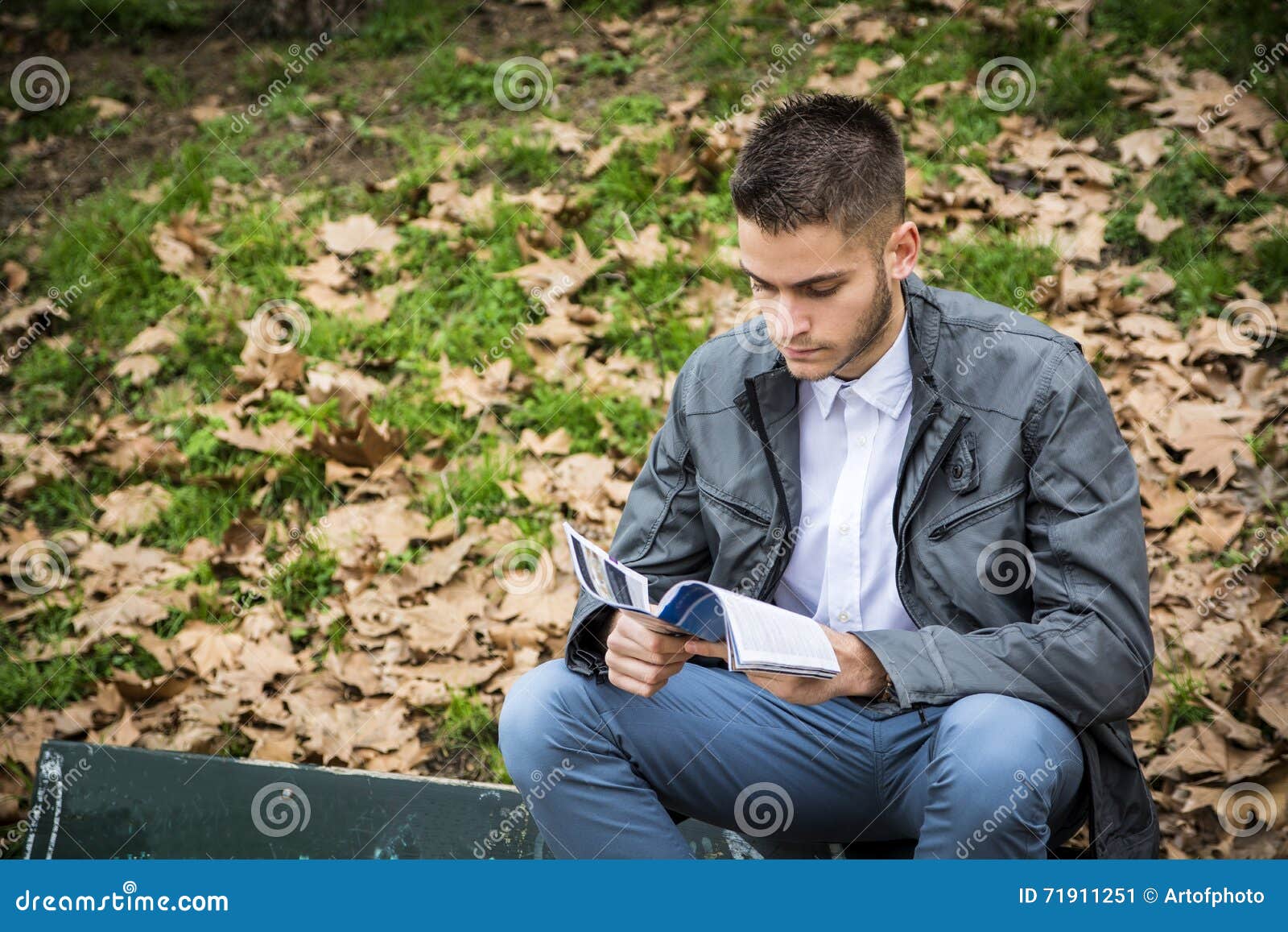 Portrait of Man Reading in Park Stock Image - Image of horizontal ...