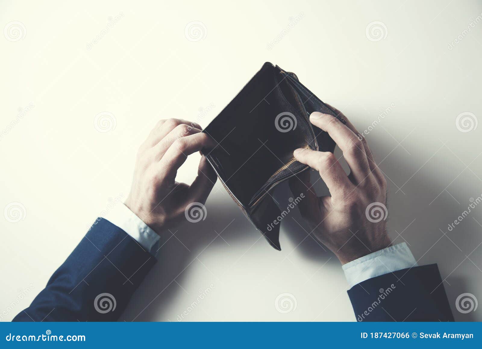 Man showing empty wallet stock photo. Image of business - 187427066