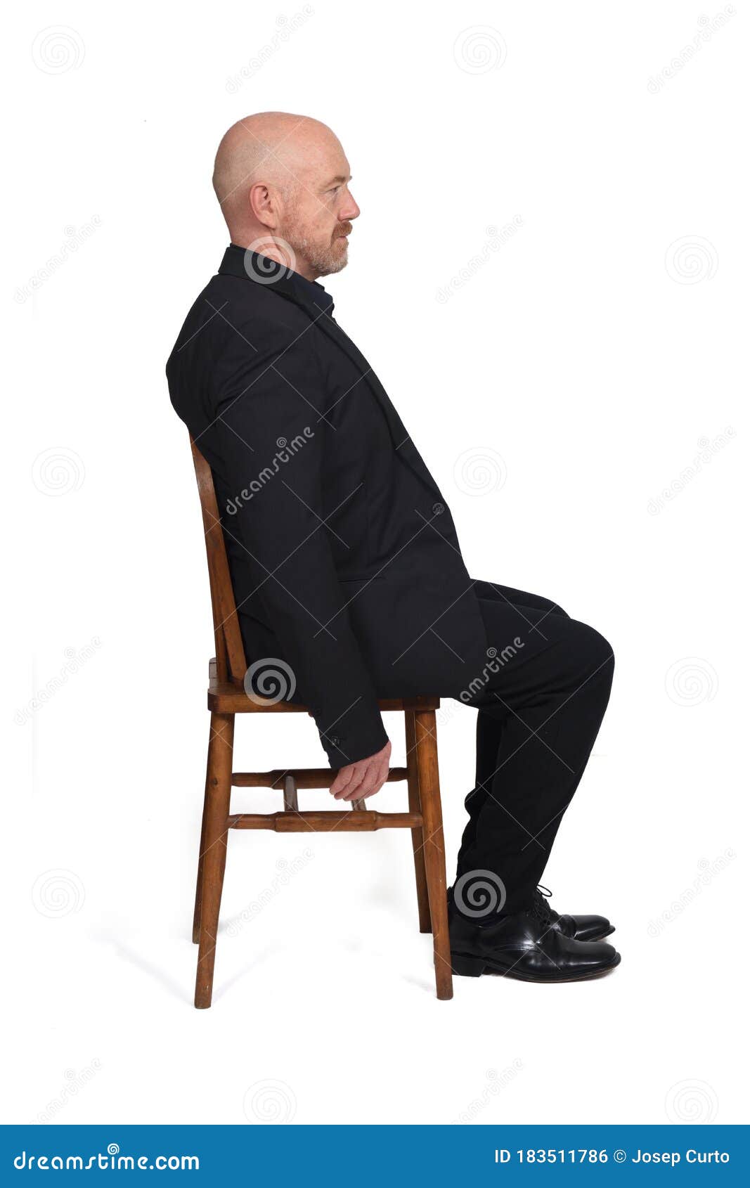 Portrait of a Man Sitting on a Chair Side View on White Background ...