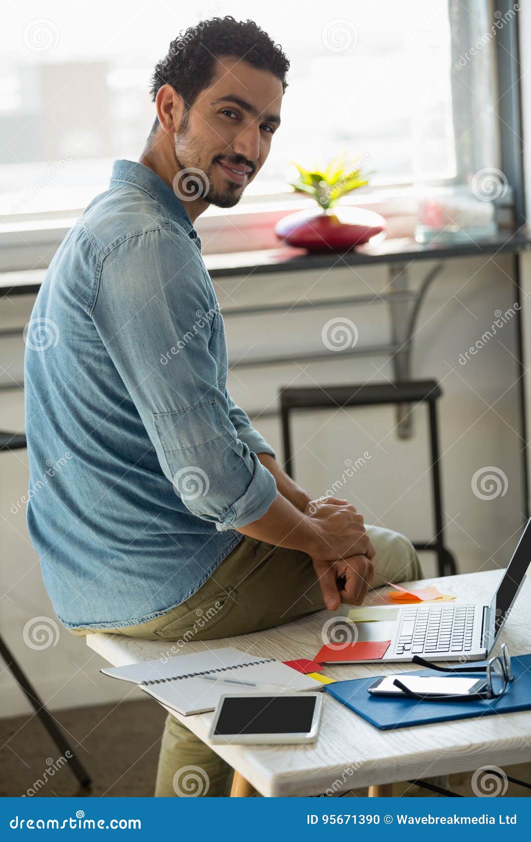 Portrait of Man Sitting on Desk in Office Stock Photo - Image of ...