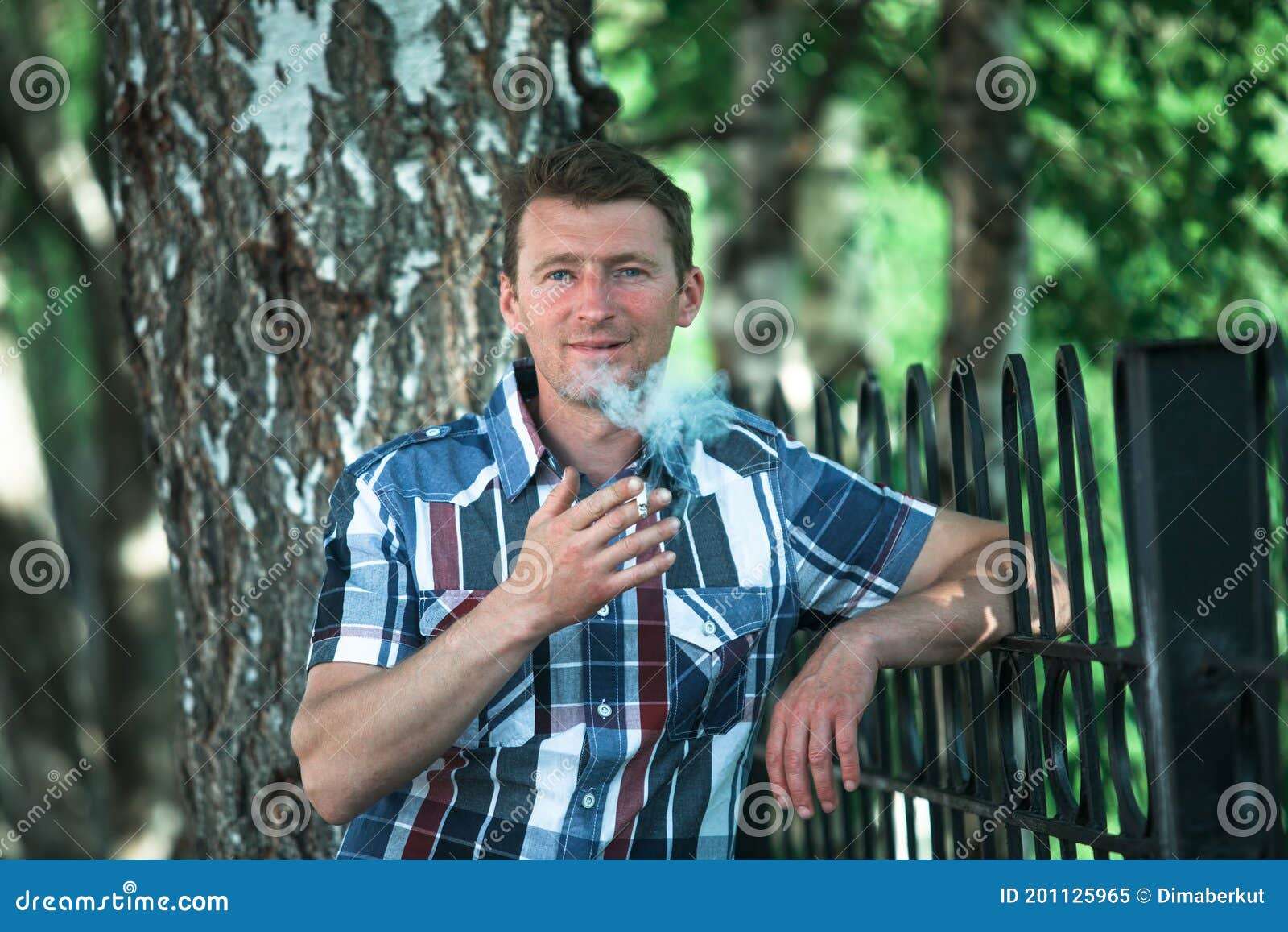 Portrait of Man Smoking Outdoor, Looking at the Camera. Stock Image ...