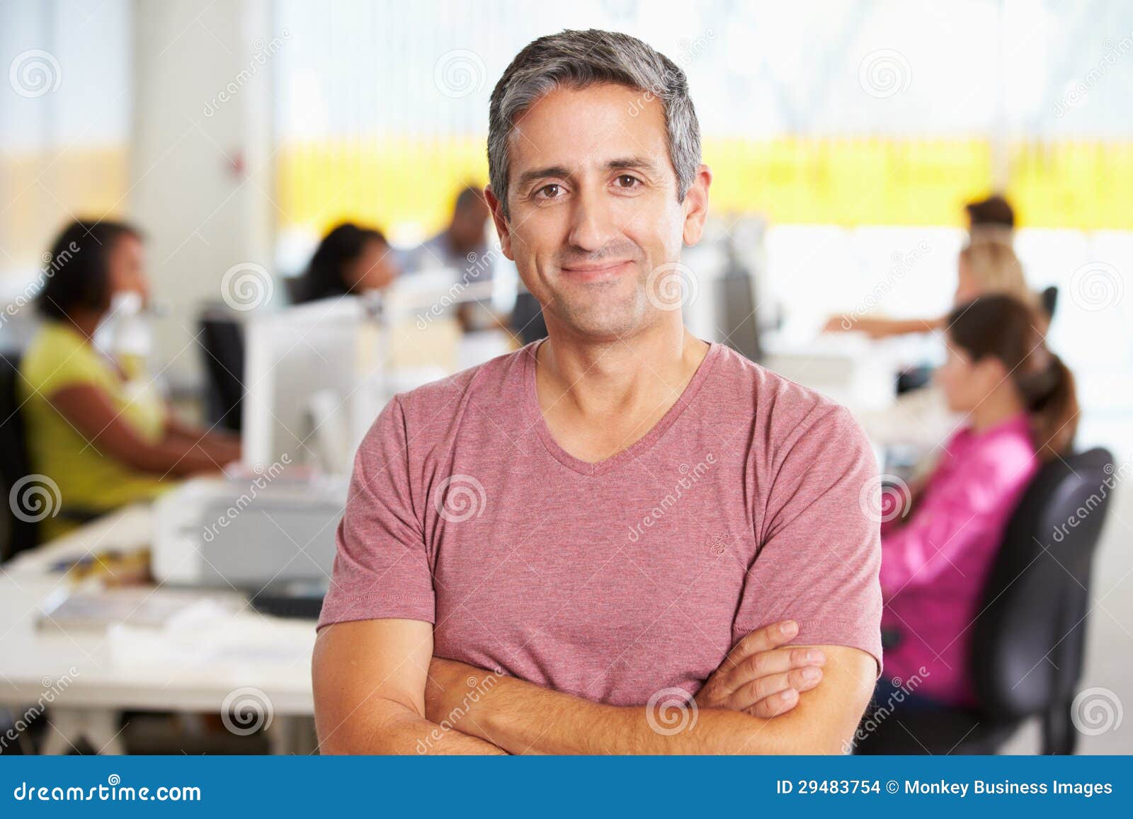 Portrait of Man Standing in Busy Creative Office Stock Photo - Image of ...
