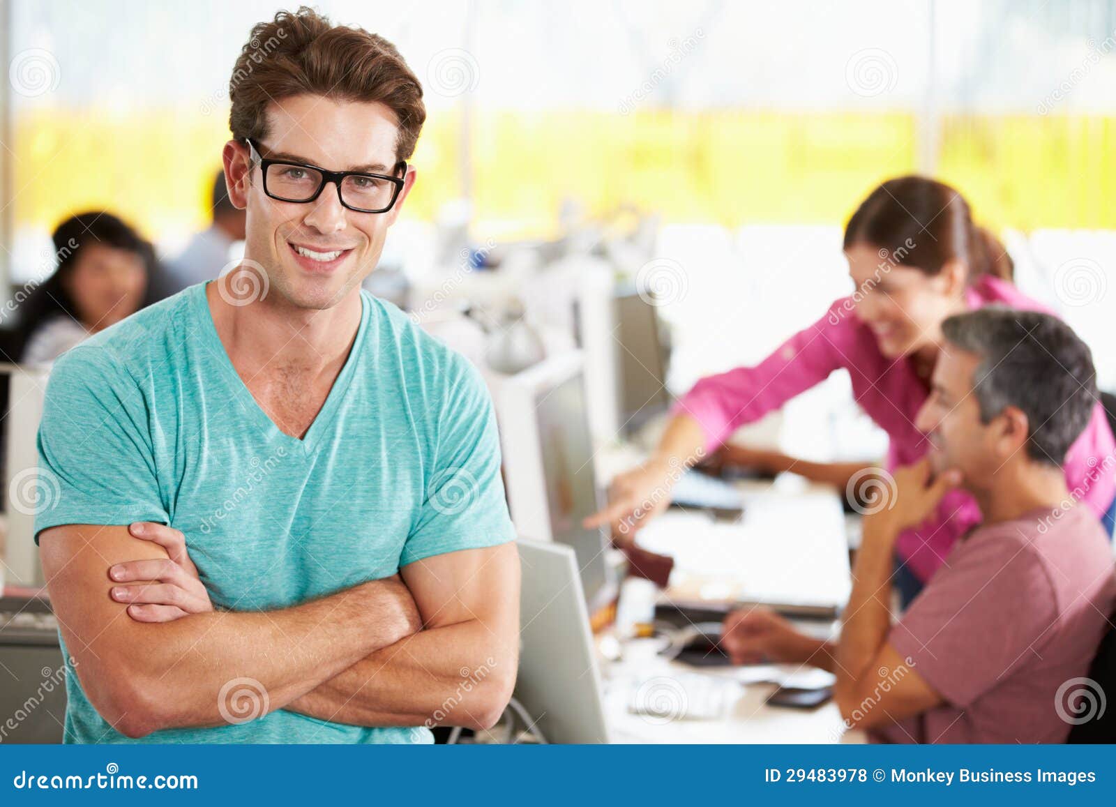 Portrait of Man Standing in Busy Creative Office Stock Photo - Image of ...