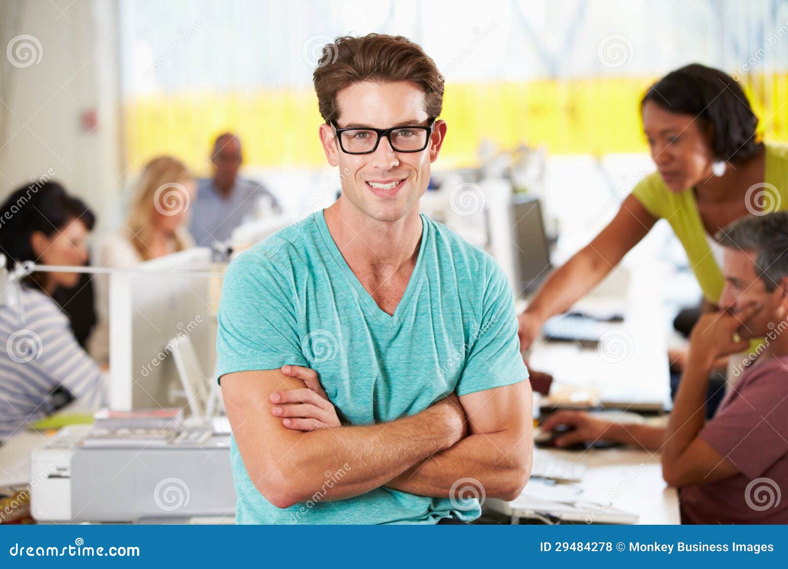 Portrait of Man Standing in Busy Creative Office Stock Photo - Image of ...