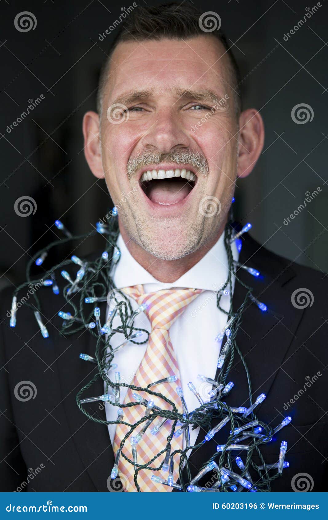 Portrait of Man in Suit with String Lights and Laughing Stock Photo ...