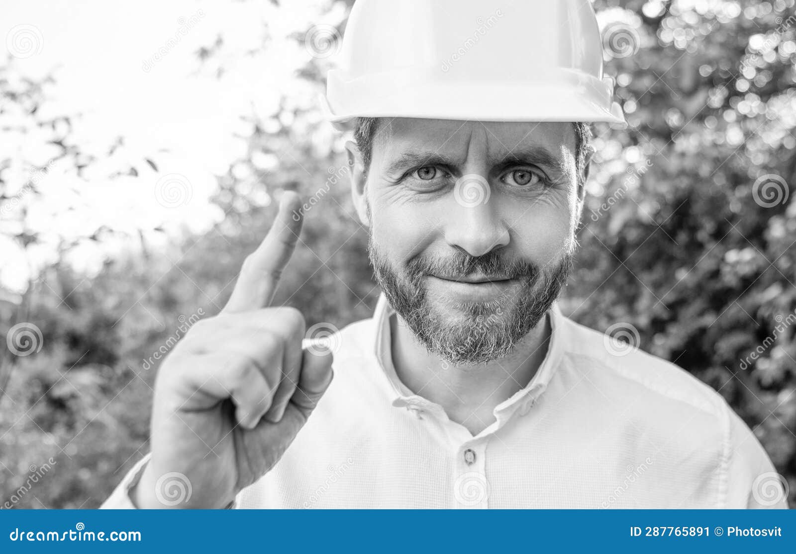 Portrait of Man Supervisor in Hardhat Pointing Finger Up Outdoors Stock ...