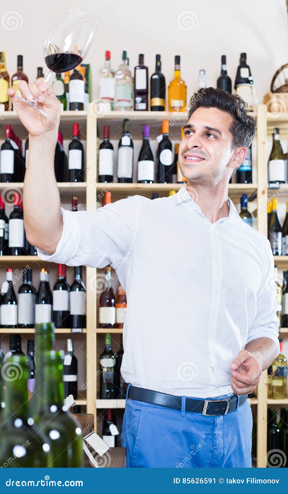 Portrait of Man Tasting Wine Sample in Glass in Shop Stock Image ...