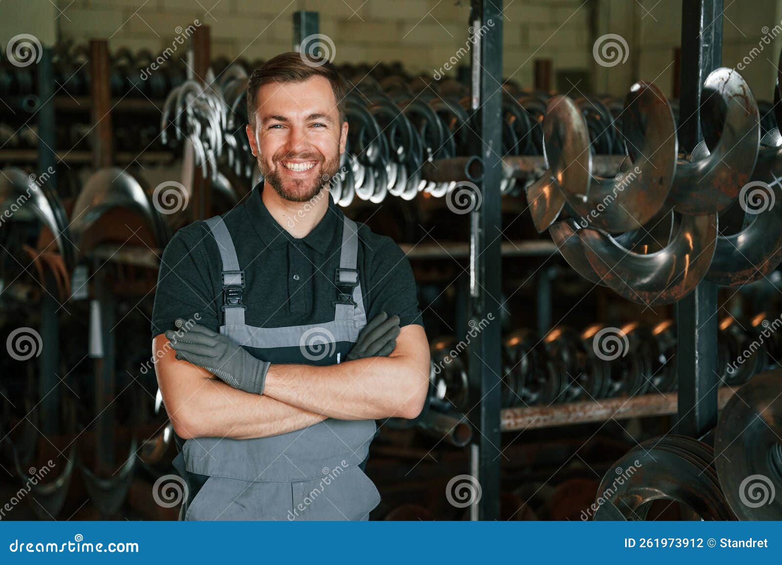 Portrait of Man in Uniform that is in Workstation Developing Details of ...