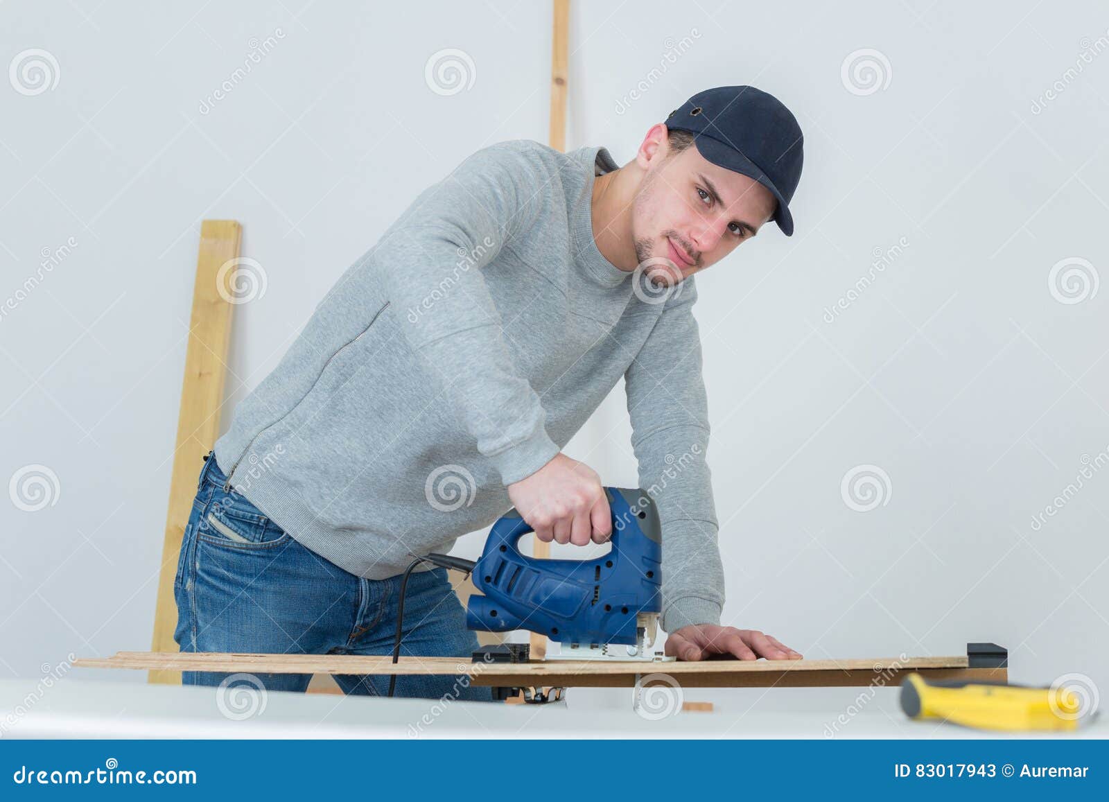 Portrait man using jigsaw stock image. Image of active - 83017943