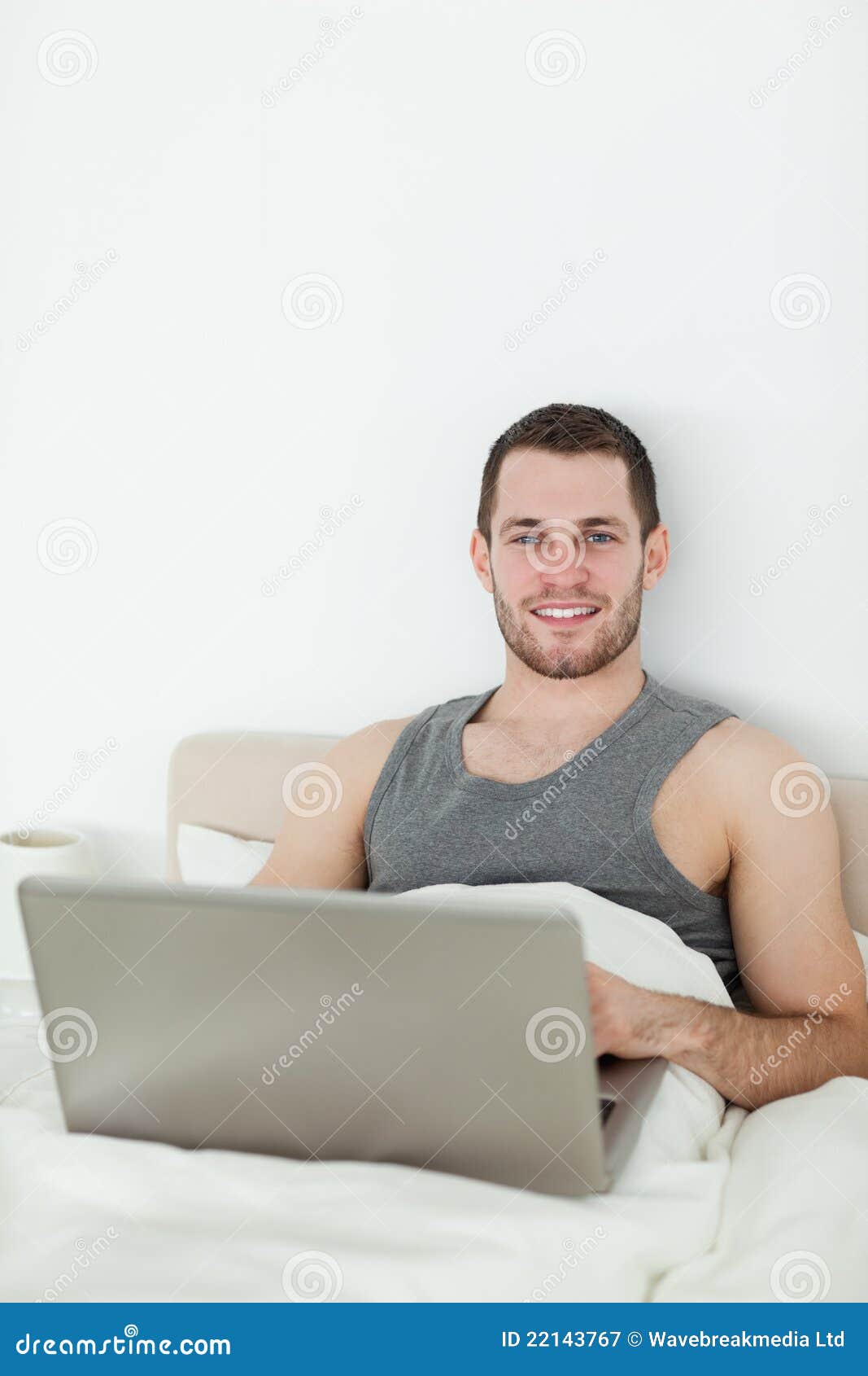 Portrait of a Man Using a Notebook Stock Image - Image of bedroom ...
