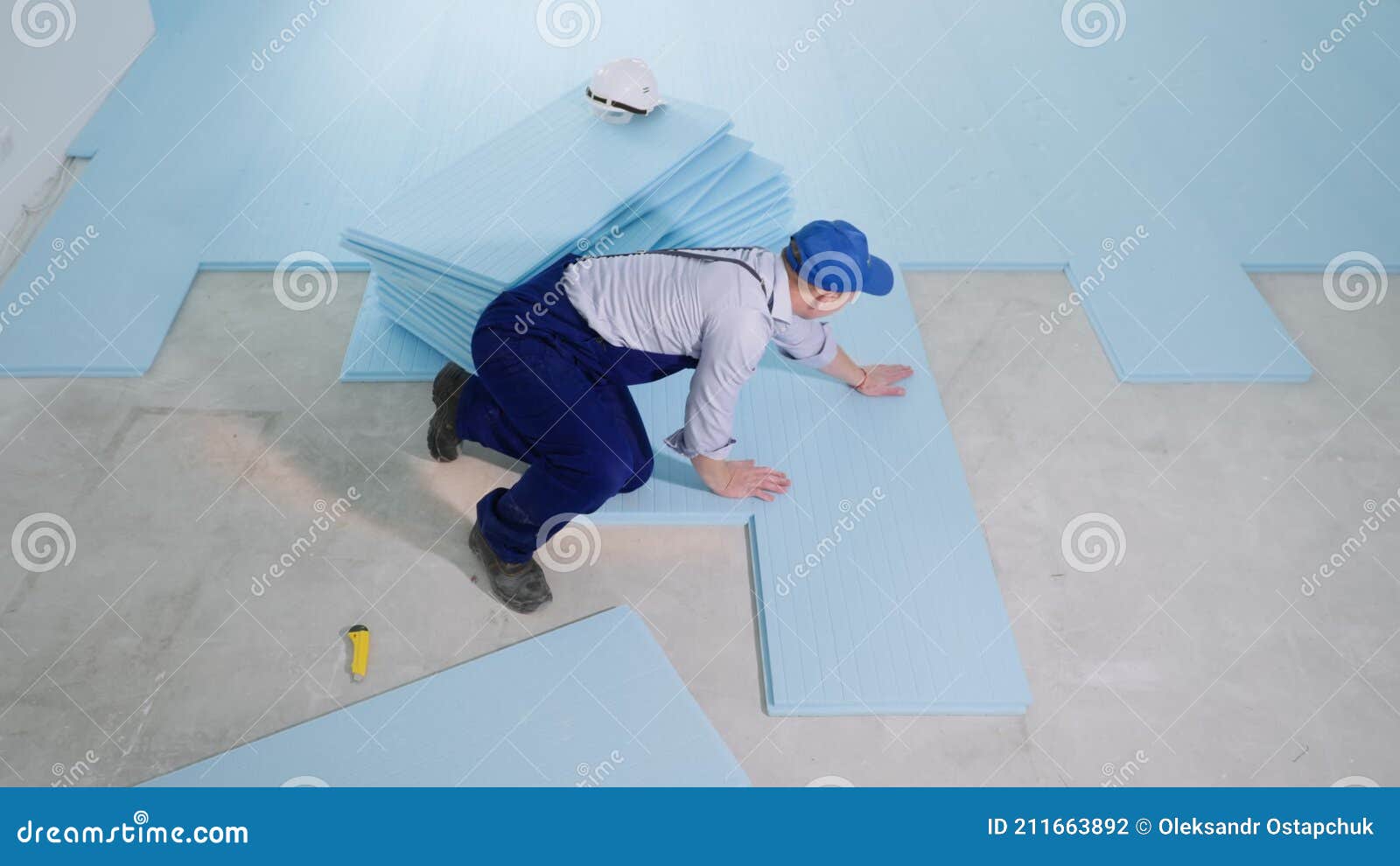 Man in Work Clothes Works As Builder on Construction Site and Lays Down ...