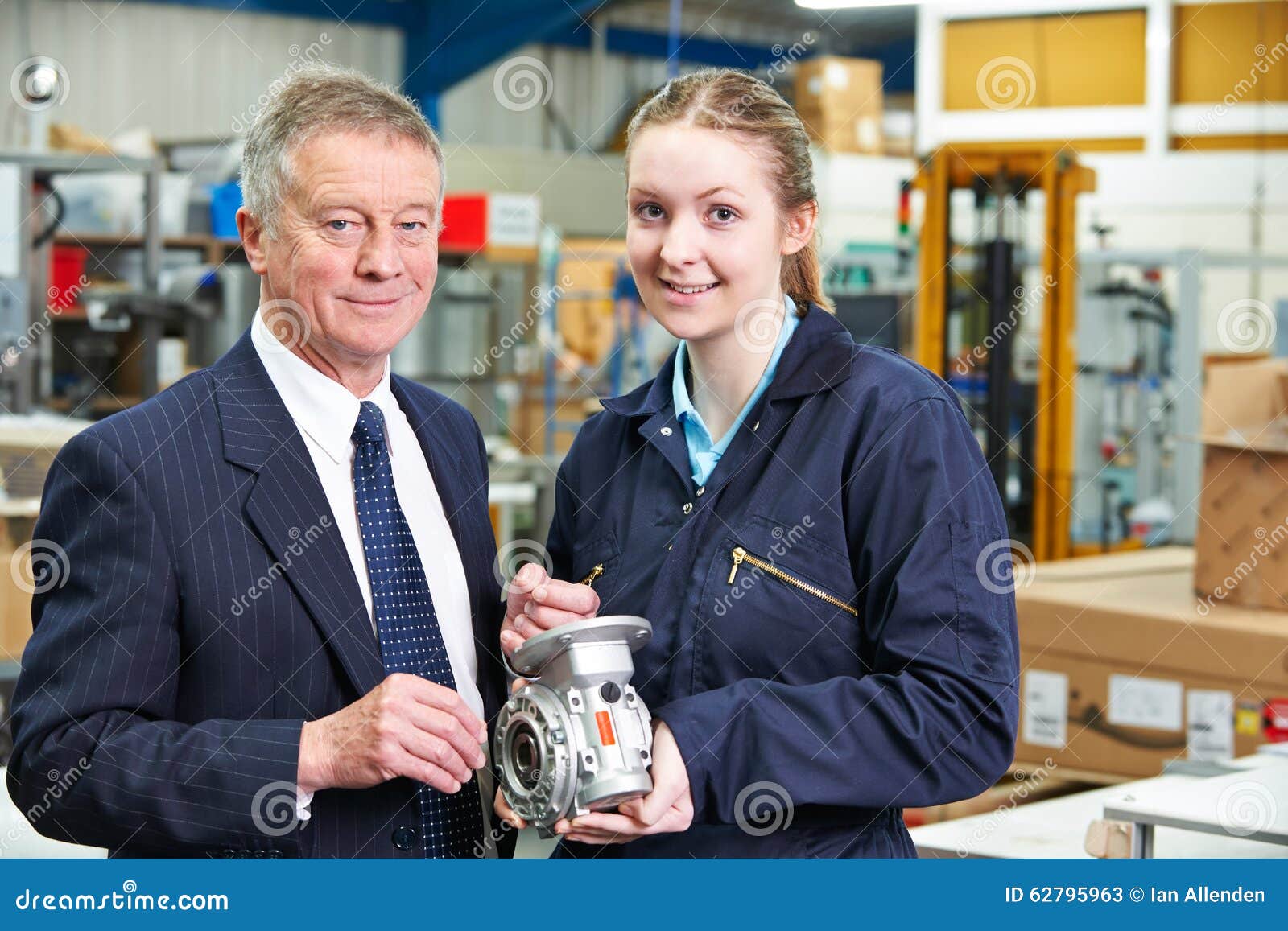 Portrait of Manager and Apprentice Engineer Inspecting Component Stock ...