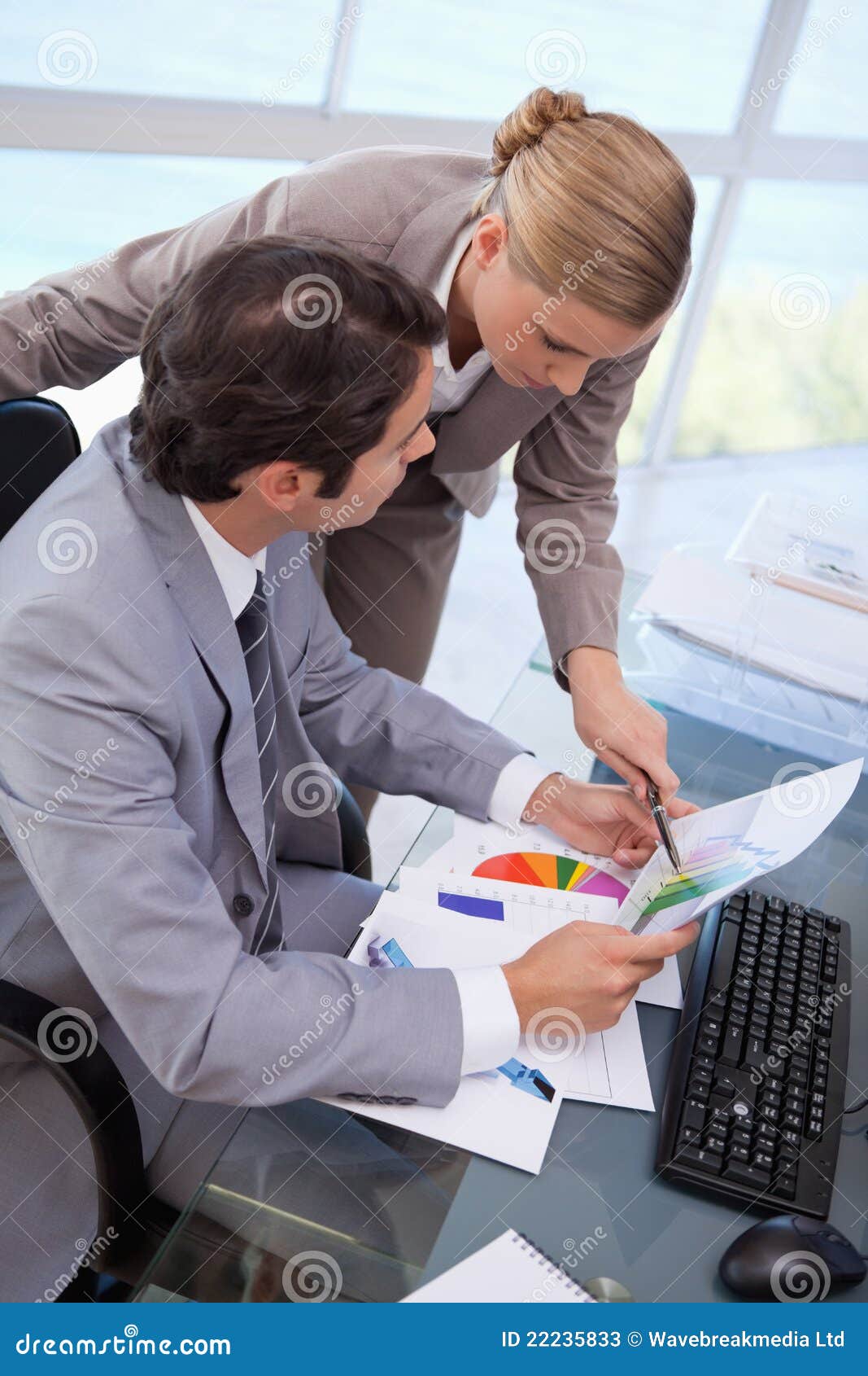 Portrait of a Manager Pointing at Something To Her Employee Stock Image ...