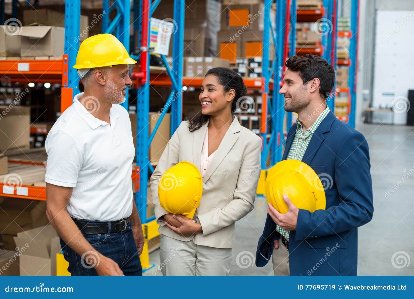 Portrait of Managers with Hard Hat are Looking Each Other and Laughing ...