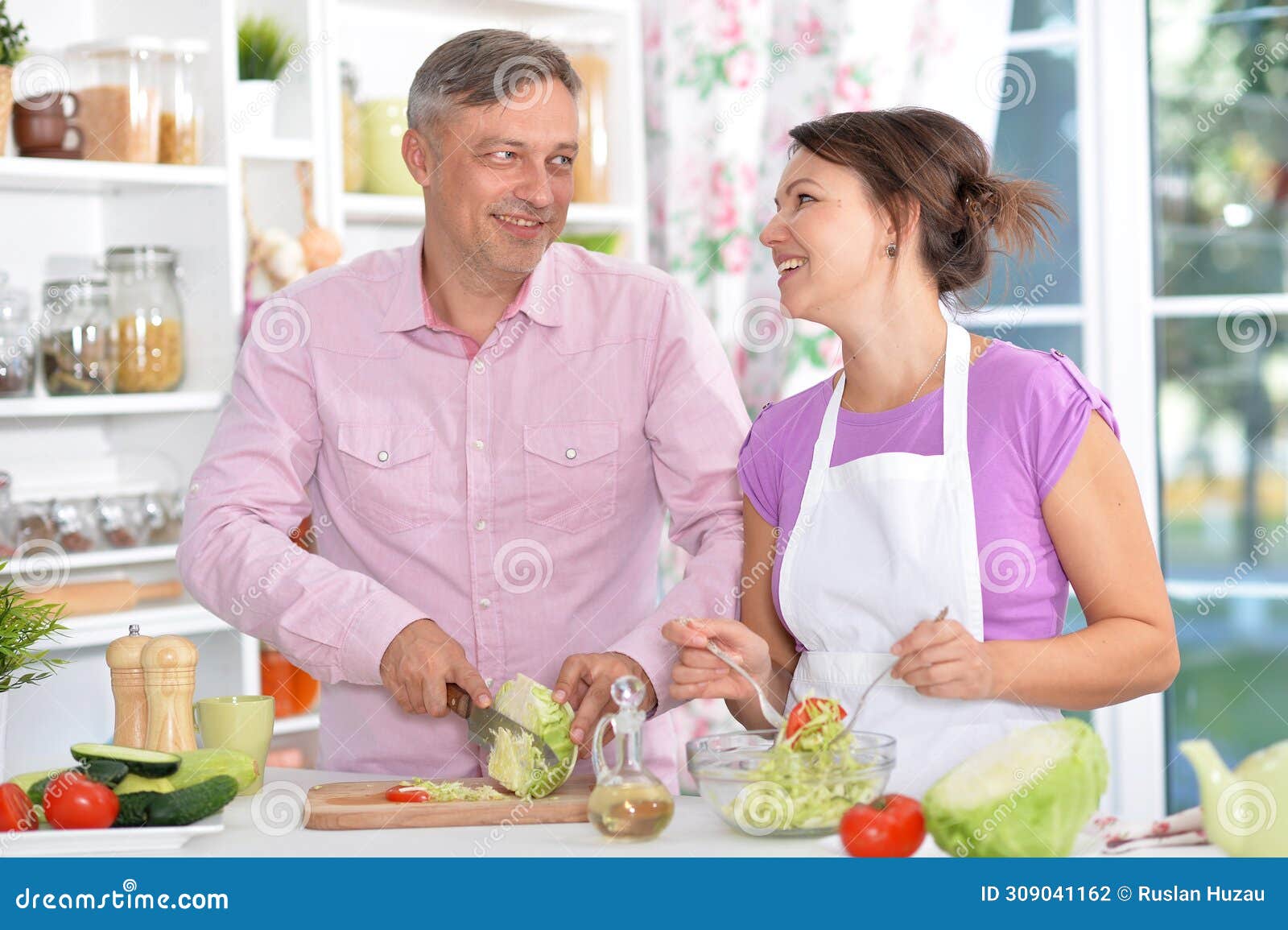 Portrait of Married Couple Cooking at Kitchen Stock Photo - Image of ...