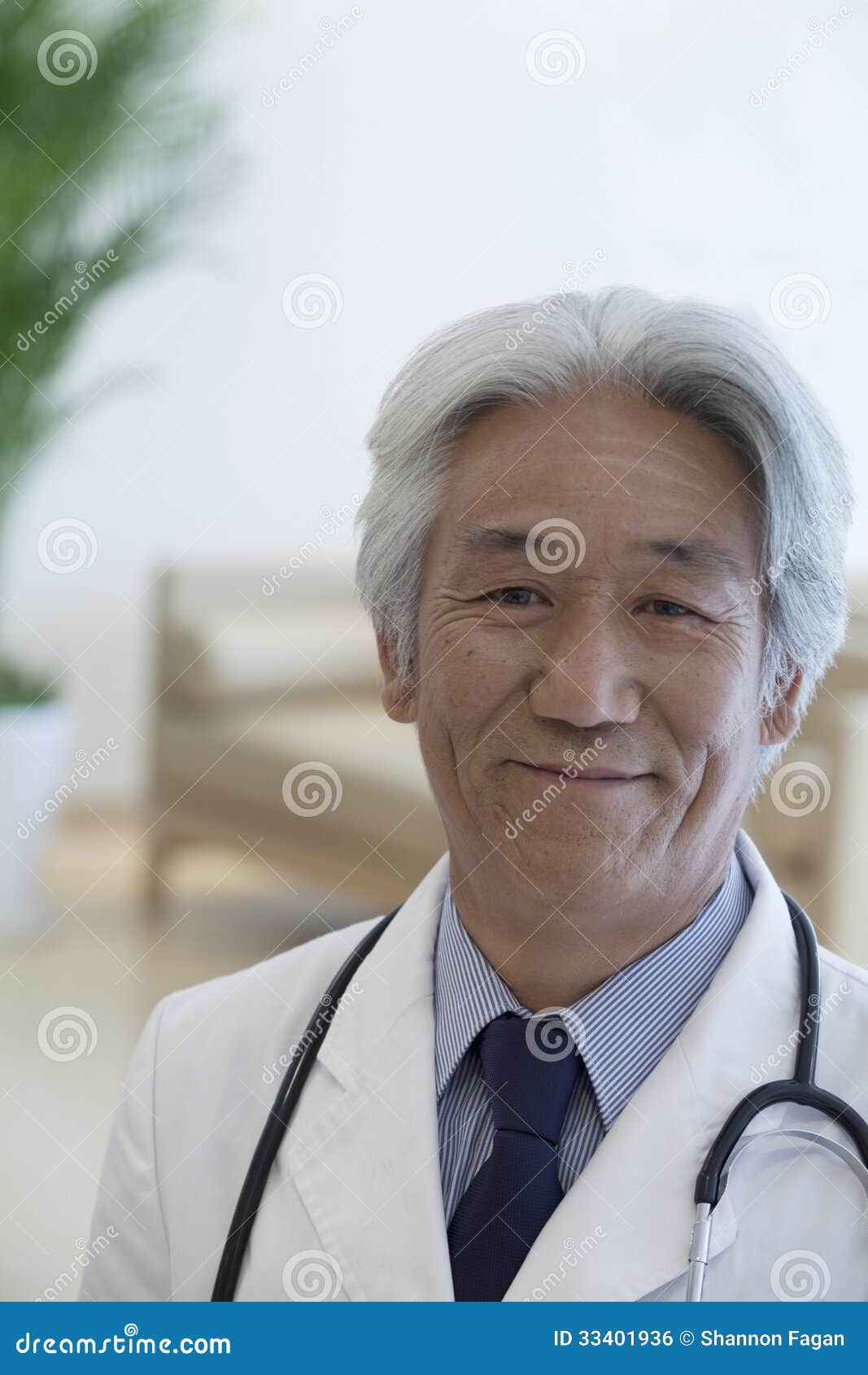 Portrait of Mature Doctor Looking at Camera and Smiling Stock Photo ...