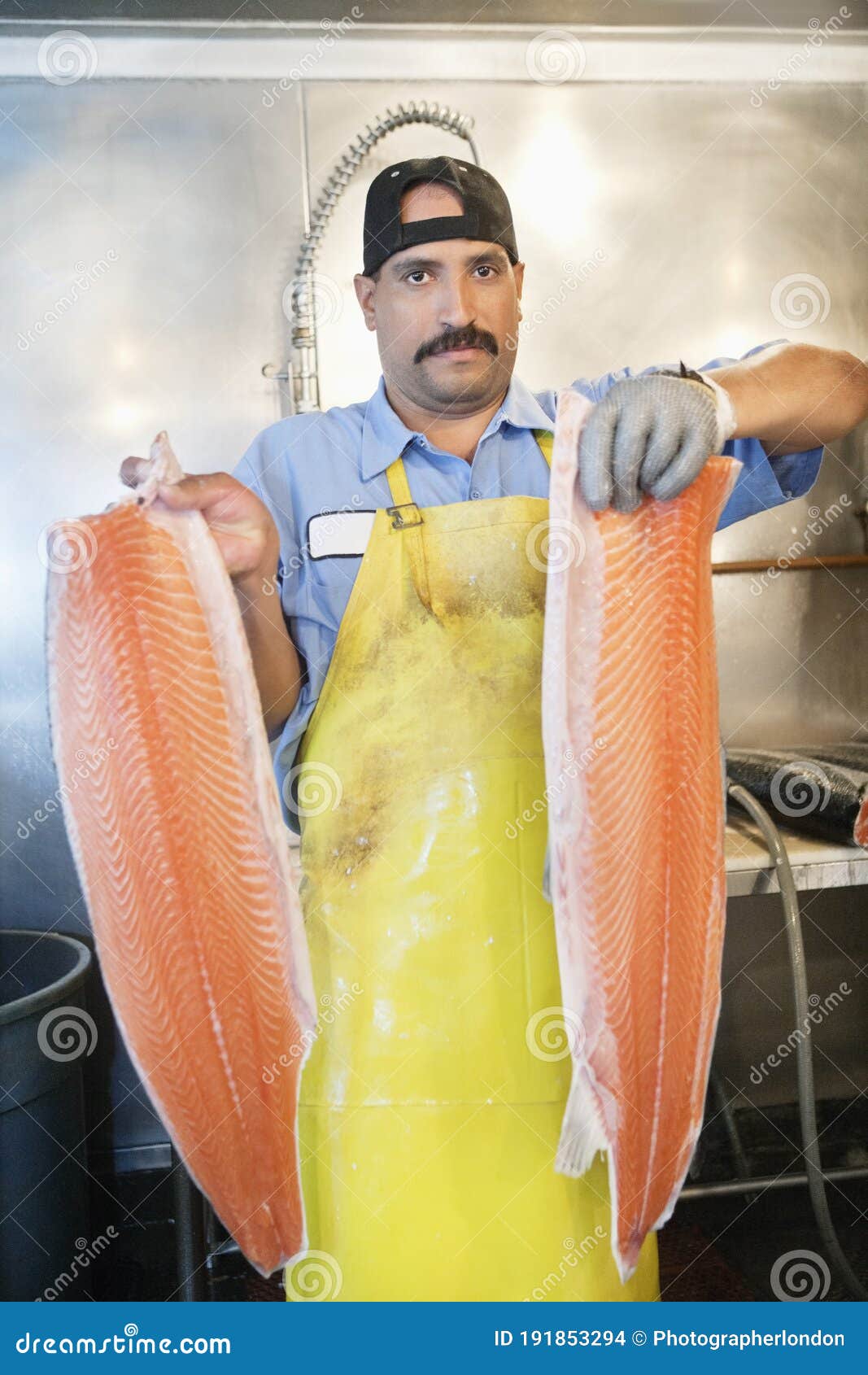Portrait of Mature Fishmonger Holding Salmon Fish Stock Photo - Image ... Portrait of Mature Fishmonger Holding Salmon Fish Stock Photo - Image ...