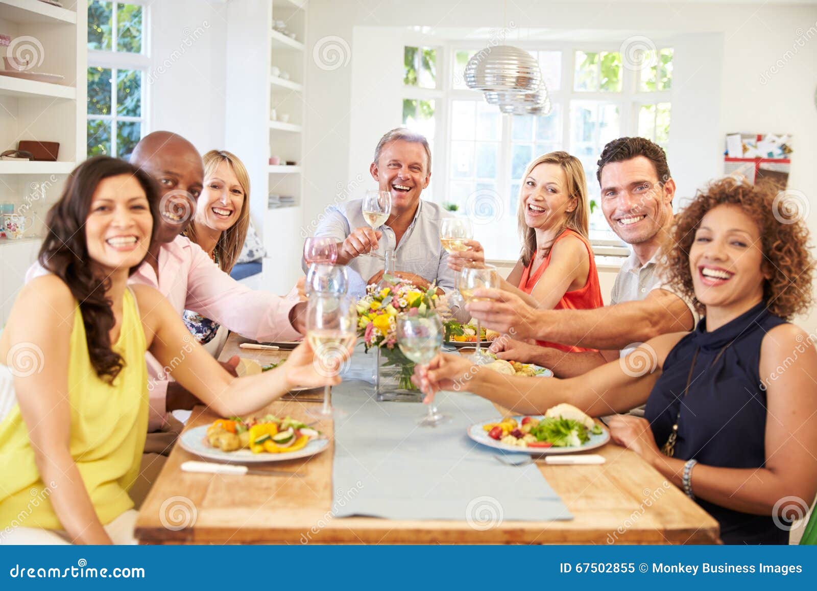 Portrait of Mature Friends Around Table at Dinner Party Stock Image ...