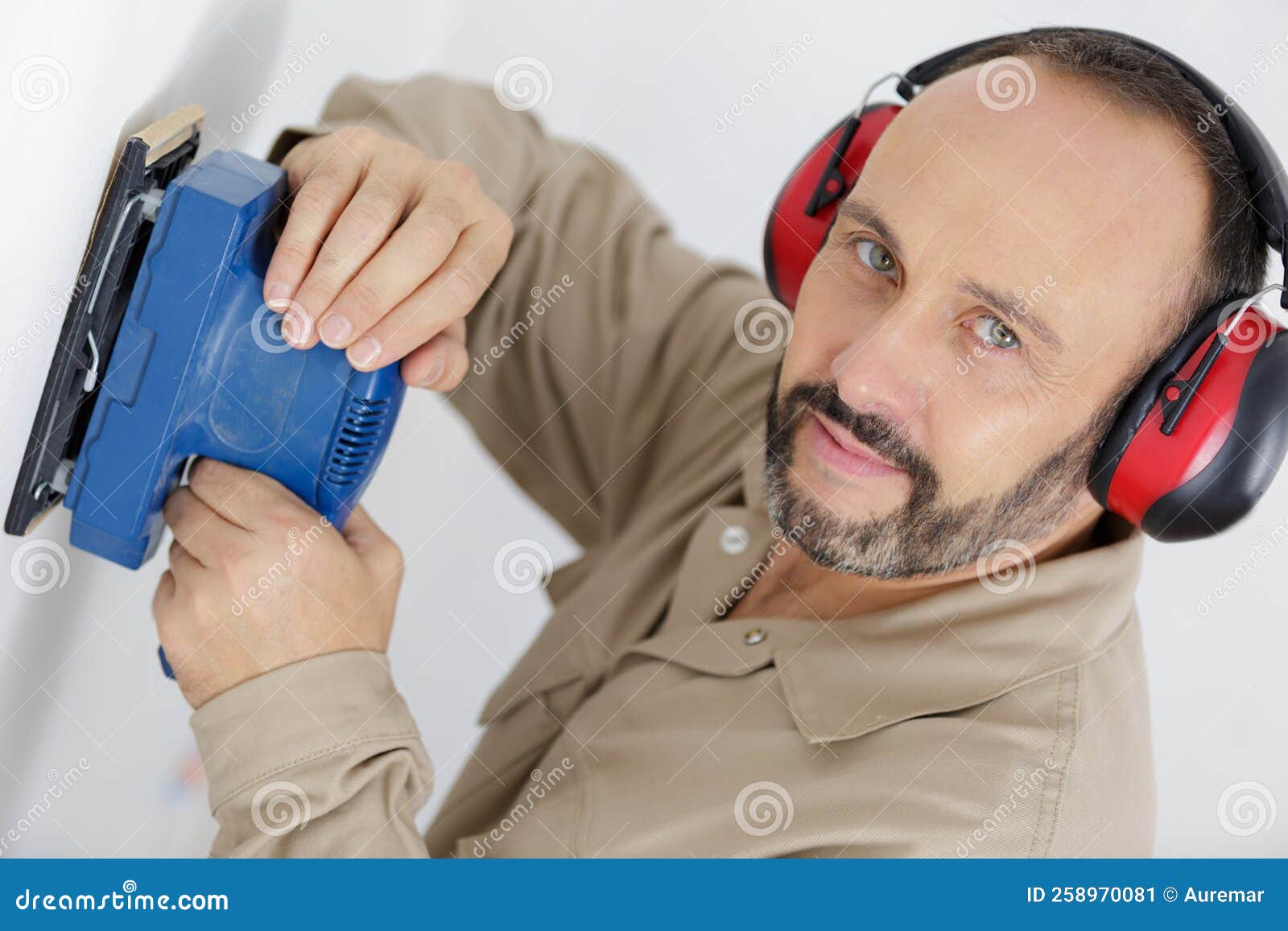 Portrait Mature Male Builder Using Sanding Machine Stock Image - Image ...