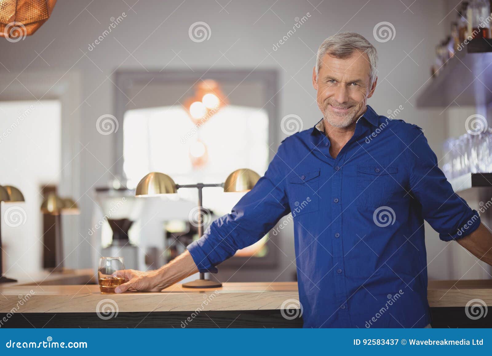 Portrait of Mature Man Standing at Counter Stock Image - Image of ...