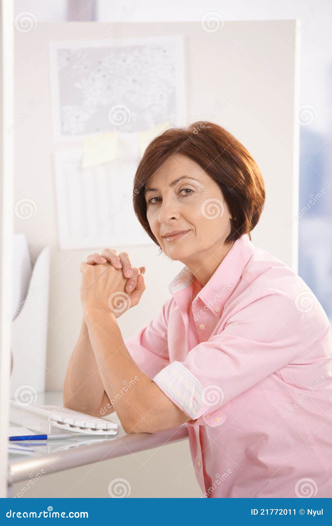 Portrait of Mature Office Worker Sitting at Desk Stock Image - Image of ...