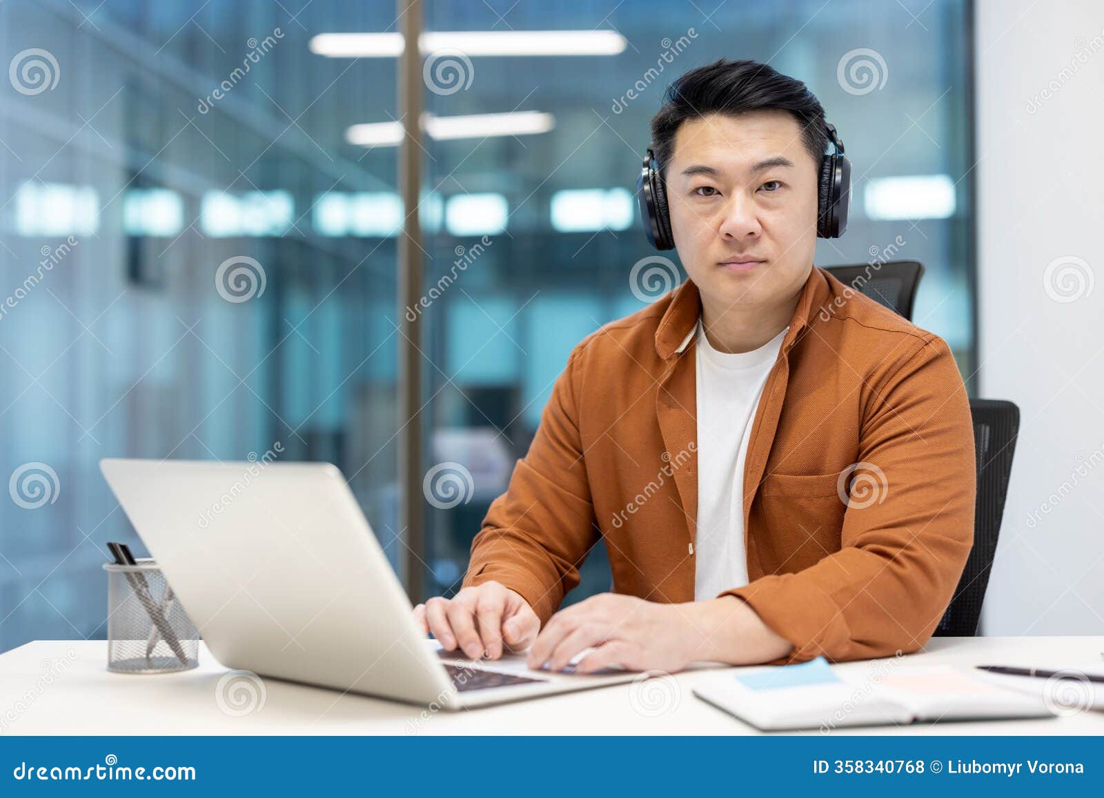 Asian Programmer Seen Typing Code For A User Interface Design On Dual ... Asian Programmer Seen Typing Code For A User Interface Design On Dual ...