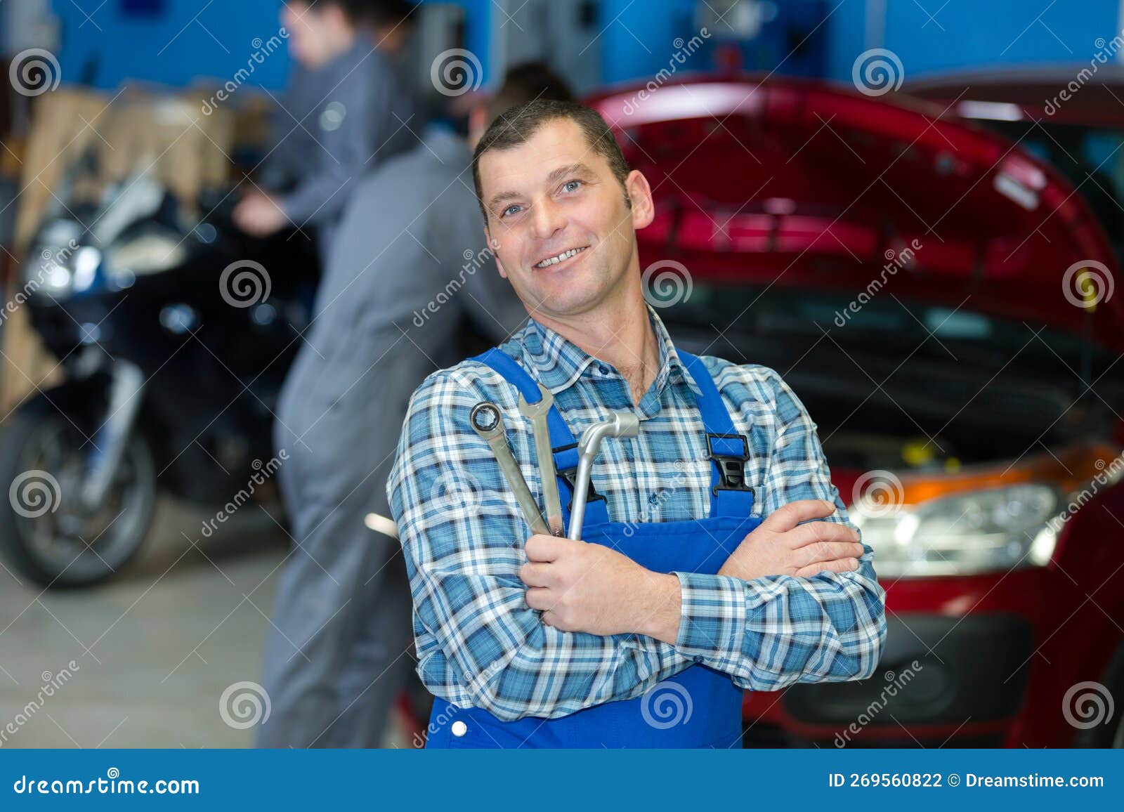 Portrait Mechanic in Garage Holding Tools Stock Photo - Image of ...