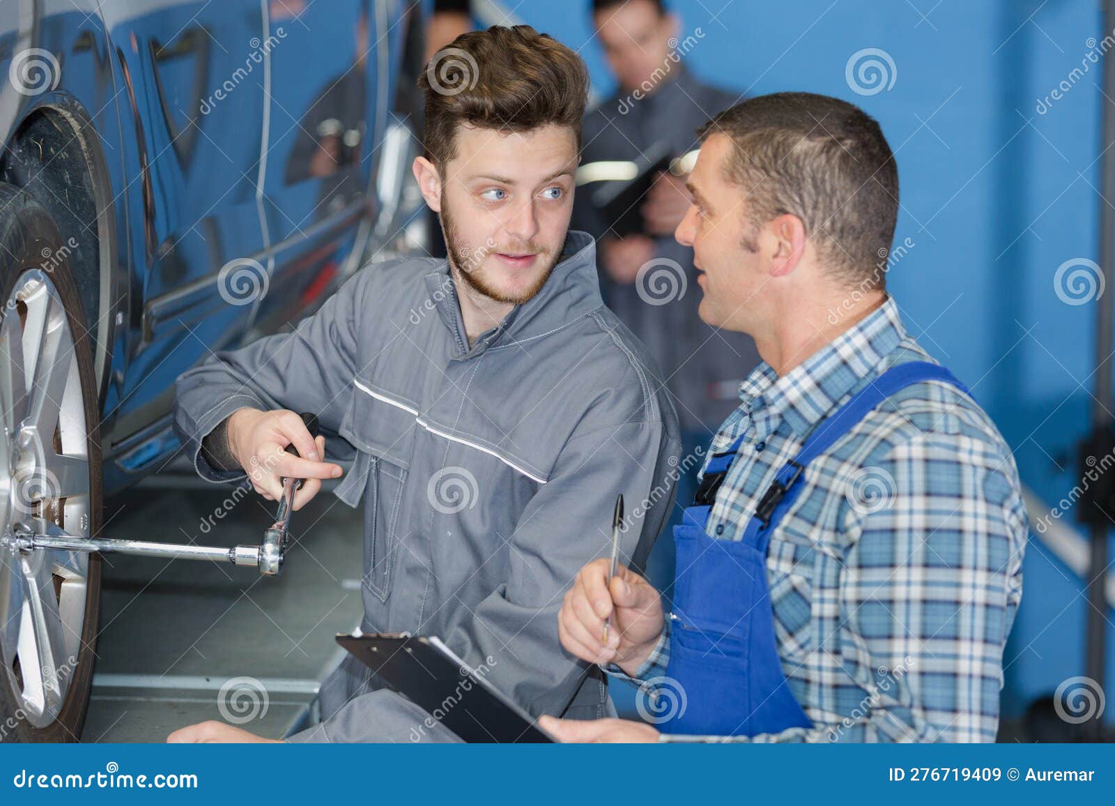 Portrait Mechanic Supervising Apprentices Work Stock Image - Image of ...