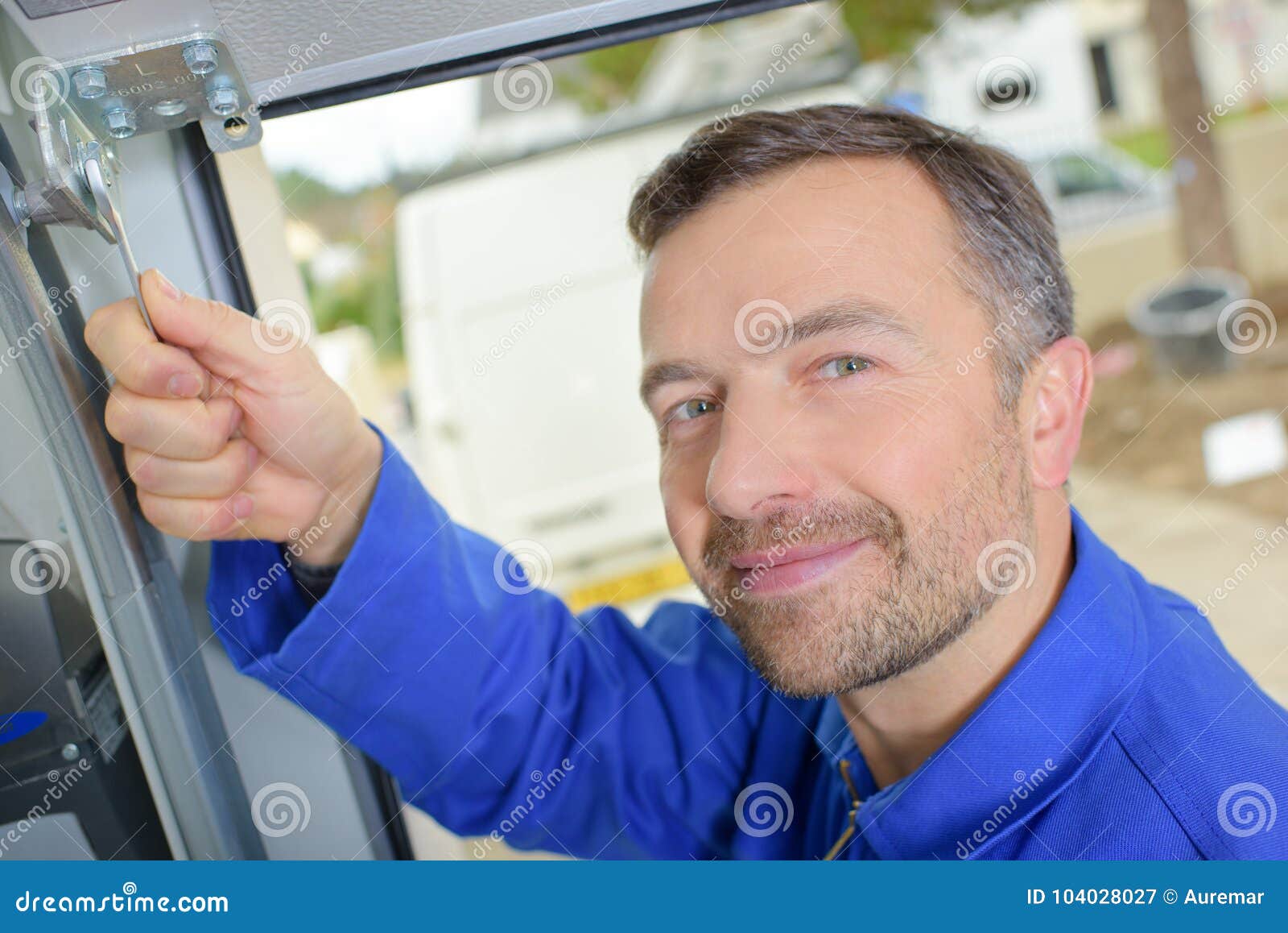 Portrait Mechanic Using Spanner Stock Image - Image of front, smiling ...
