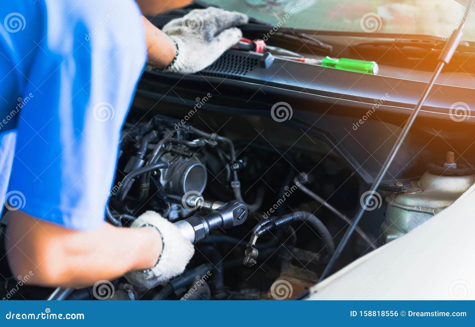Portrait of Mechanical Repairing Engine Car in Workshop Stock Photo ...